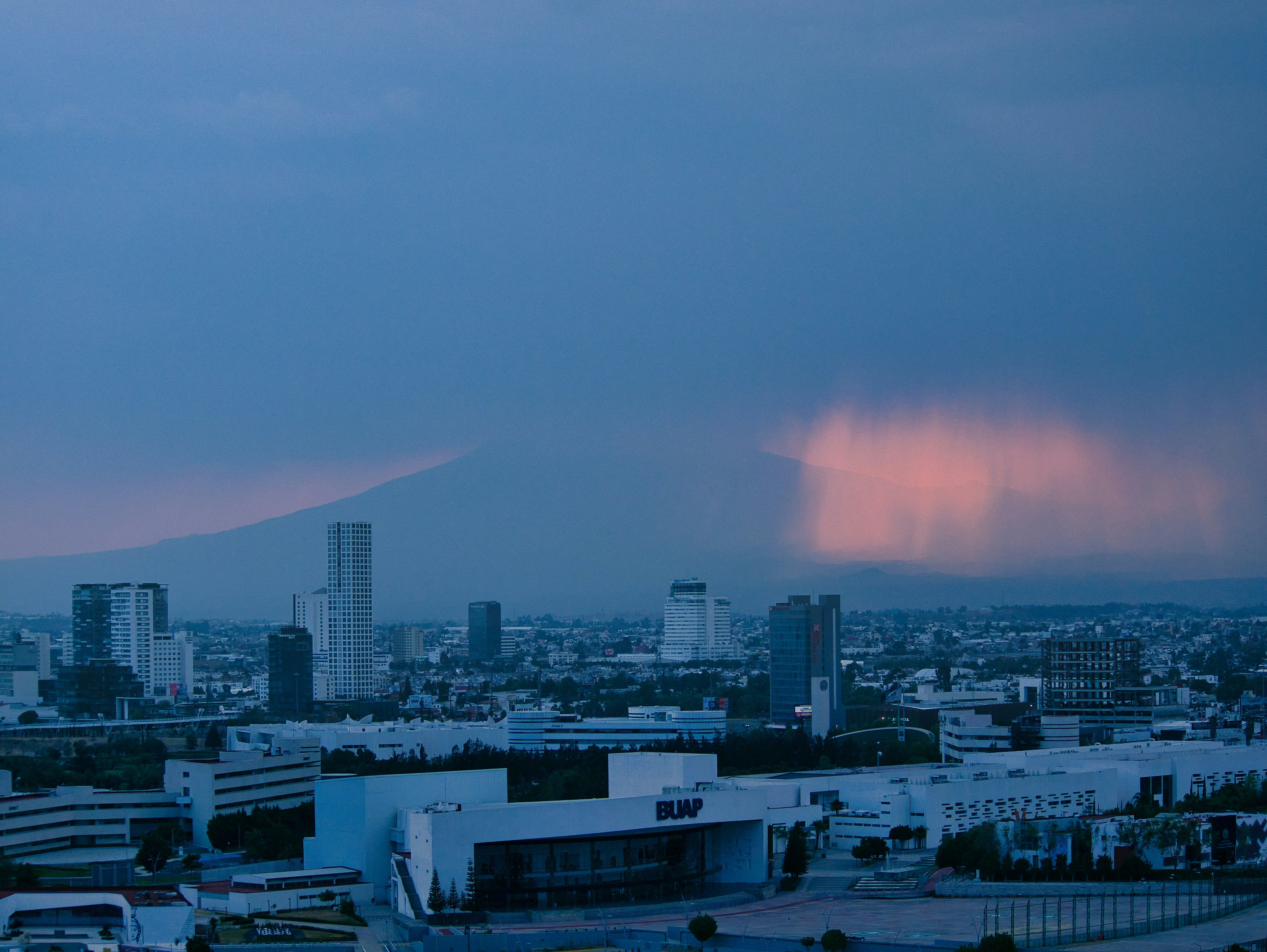 Evening Rain Shadows Over a Quiet Urban Basin
