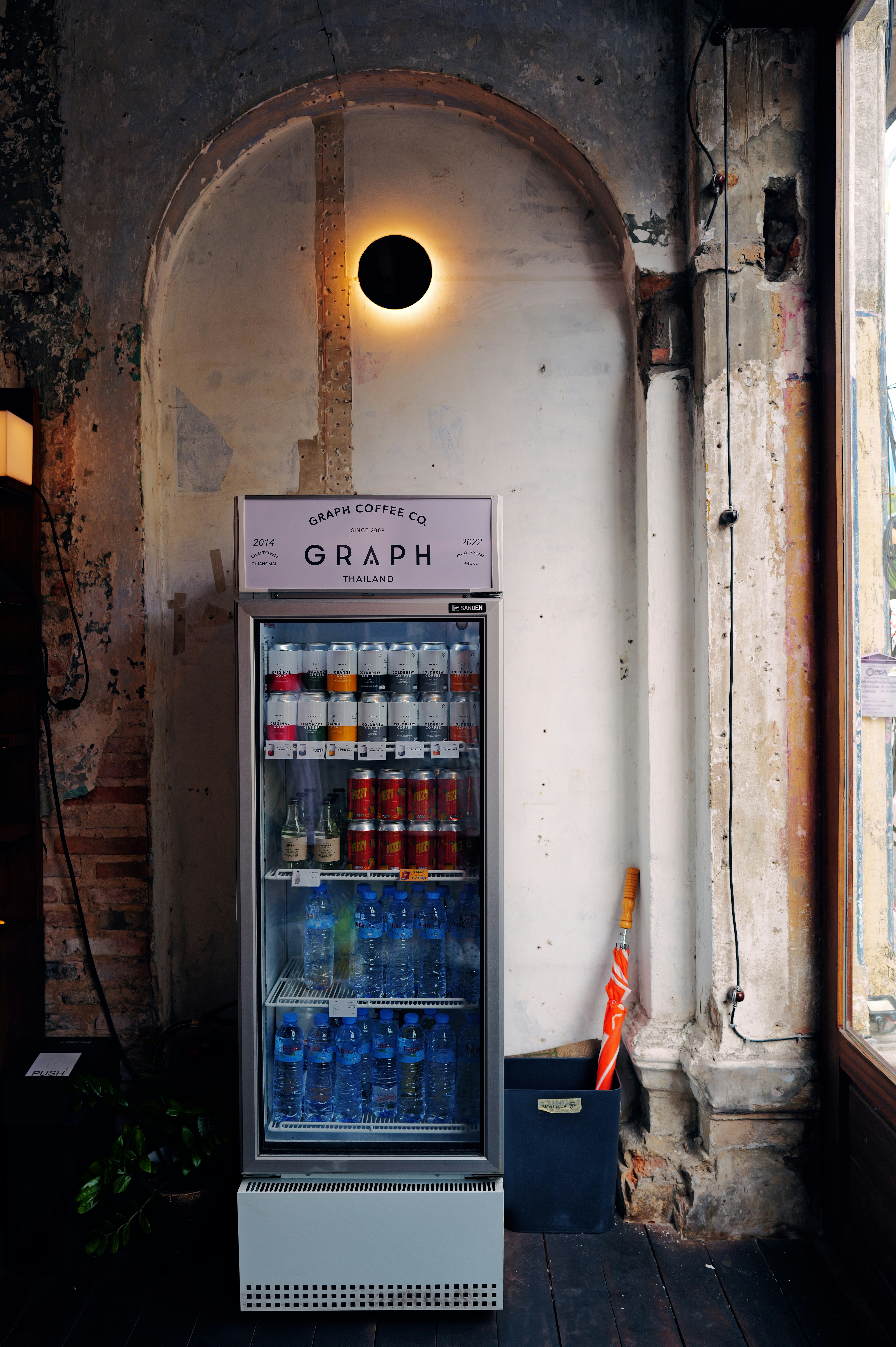 A vending machine sitting in front of a window photo – Free Grey Image ...