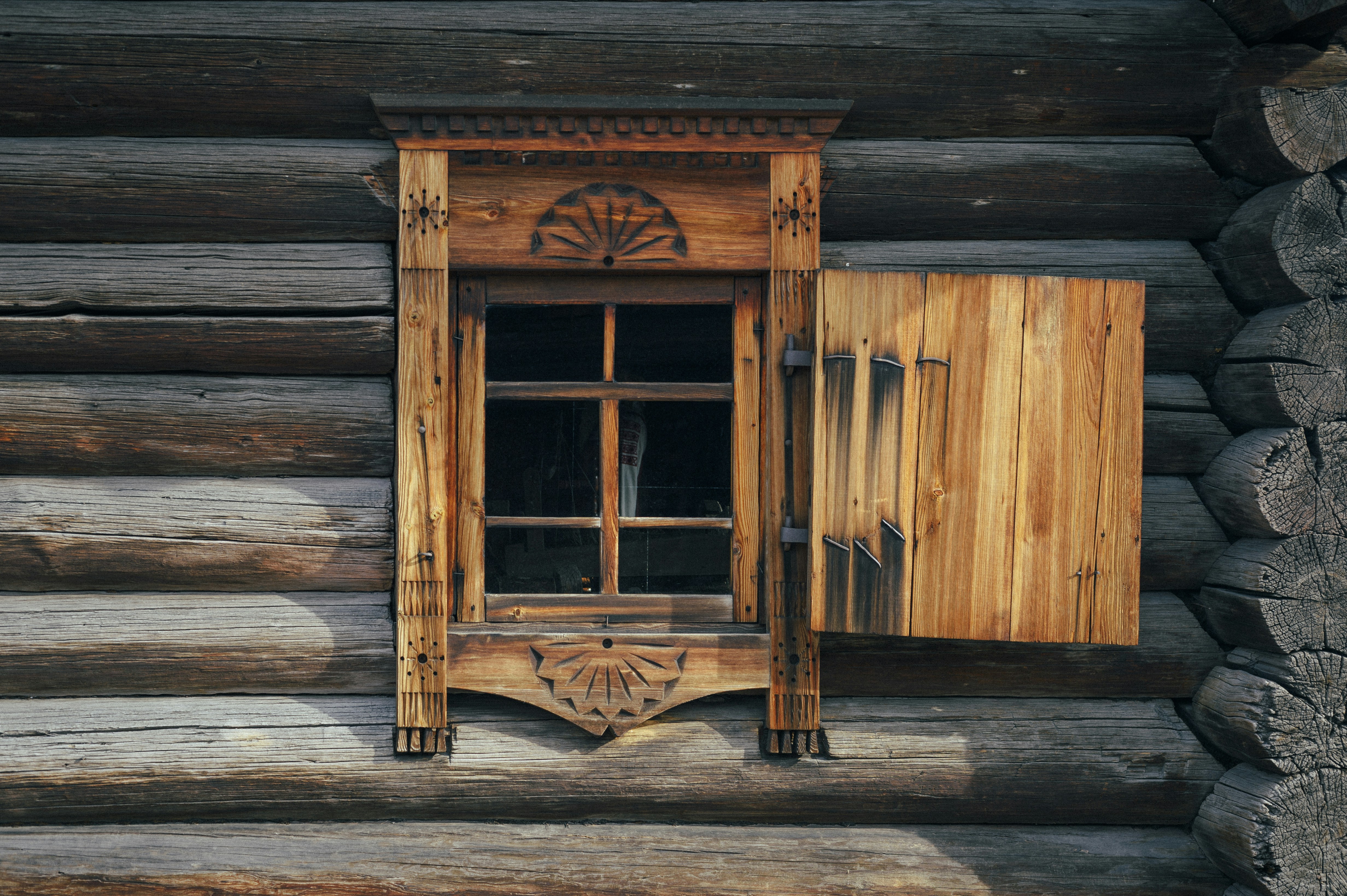A window in a log cabin with wooden shutters photo – Free Ангарская ...