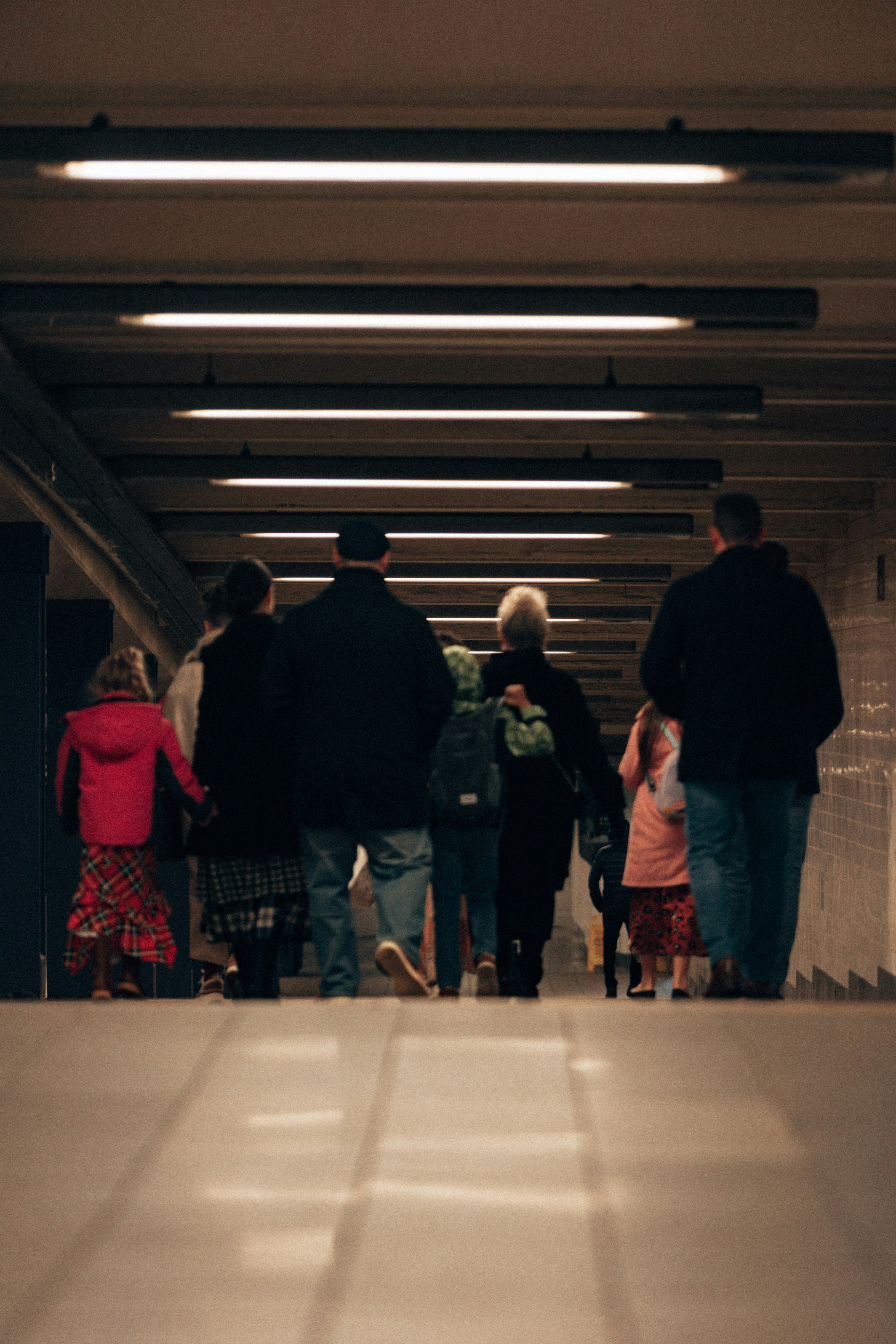 A group of people walking down a hallway photo – Free New york Image on ...