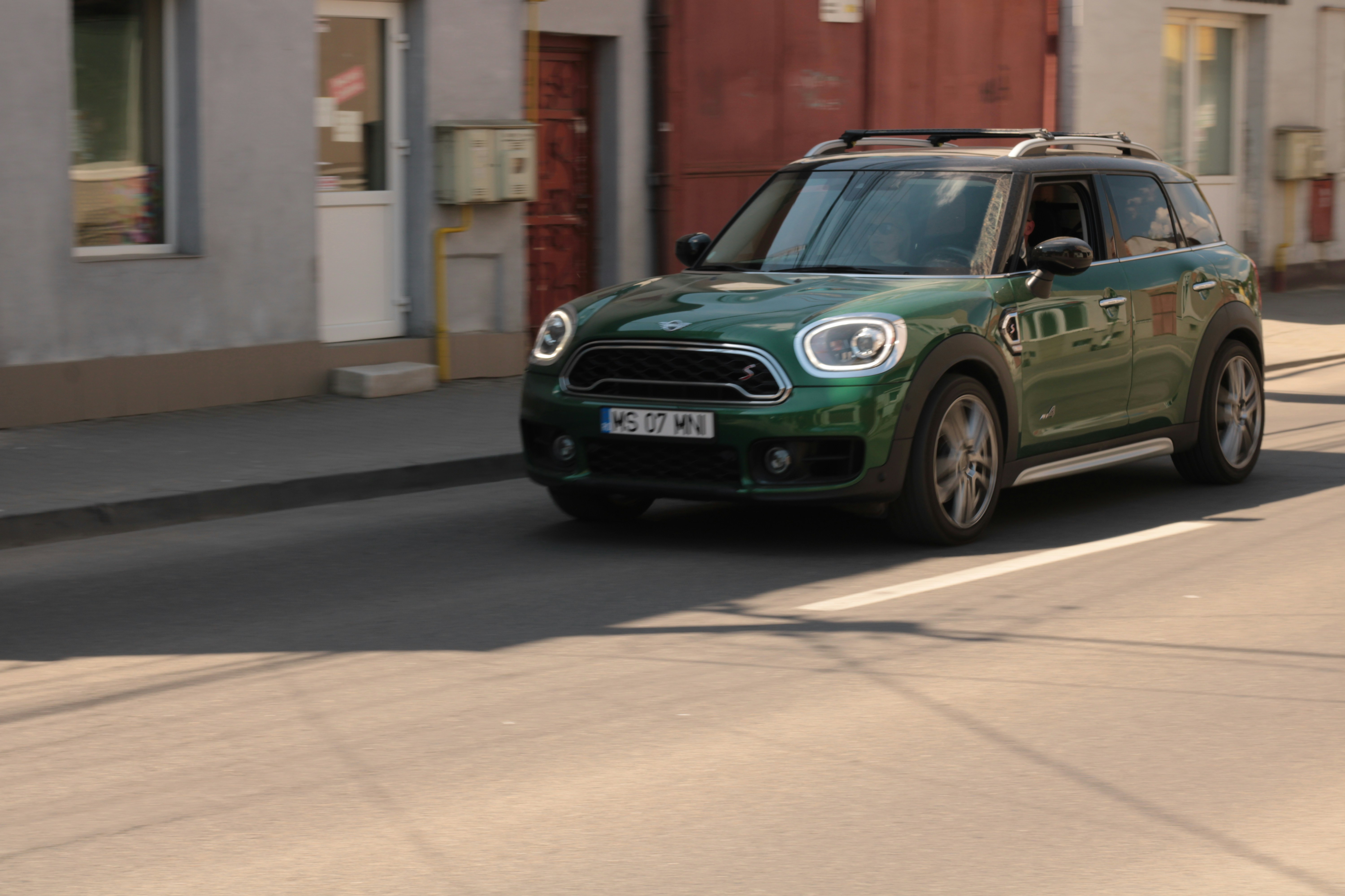 Green City Cruiser: Mini SUV on a Sunlit Urban Street