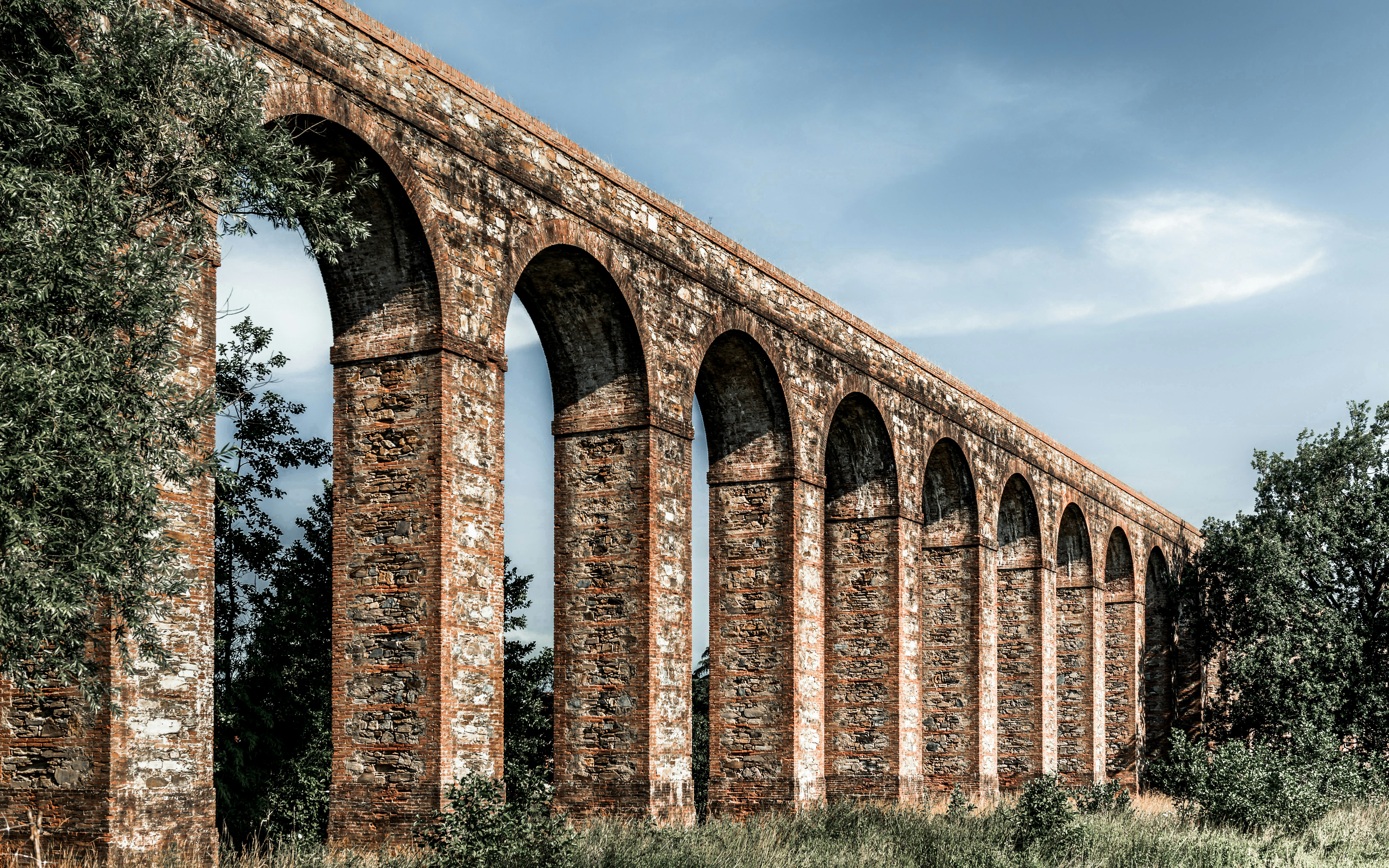 An old brick bridge with arches and arches photo – Free Panorama Image ...