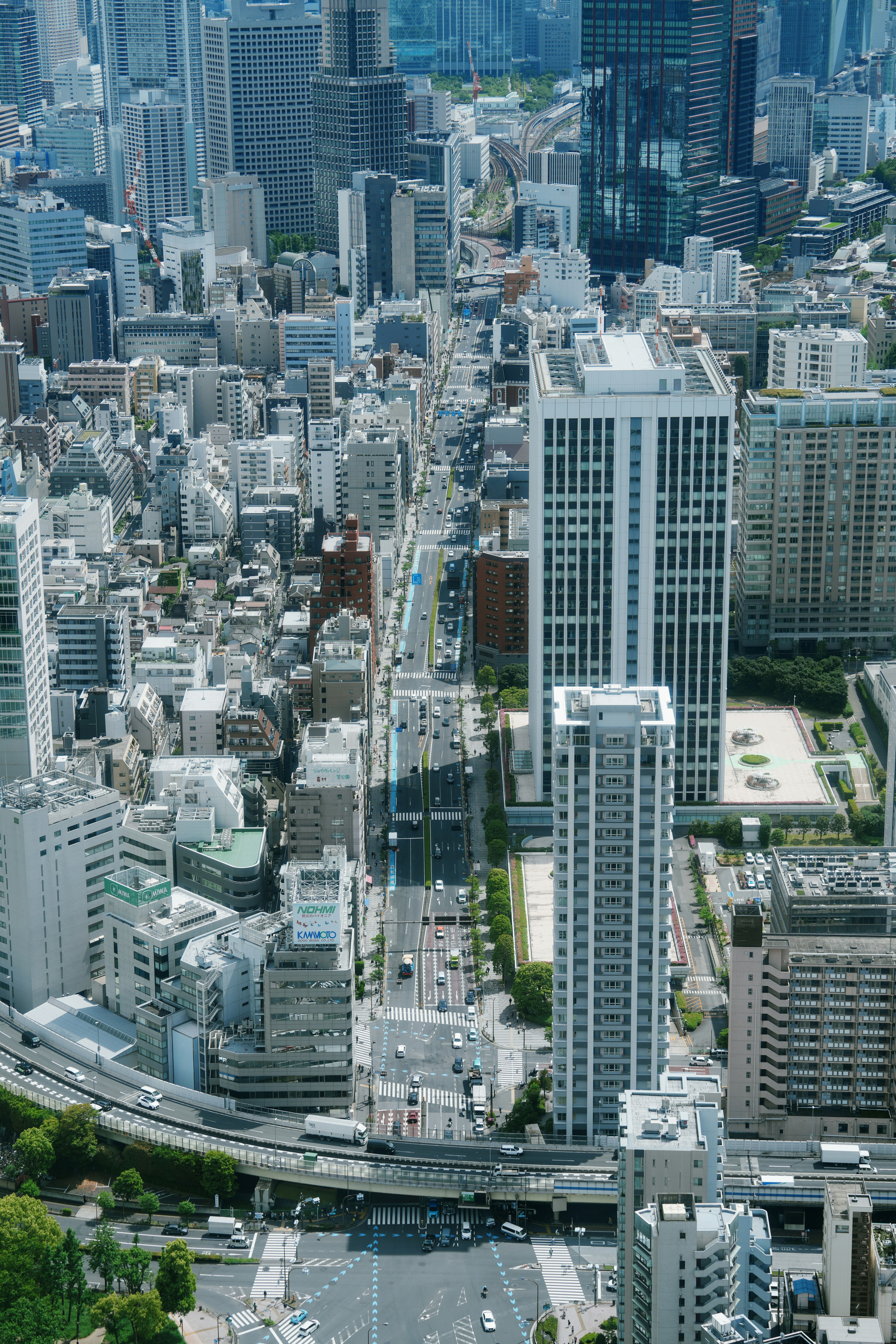 An aerial view of a city with tall buildings photo – Free City Image on ...