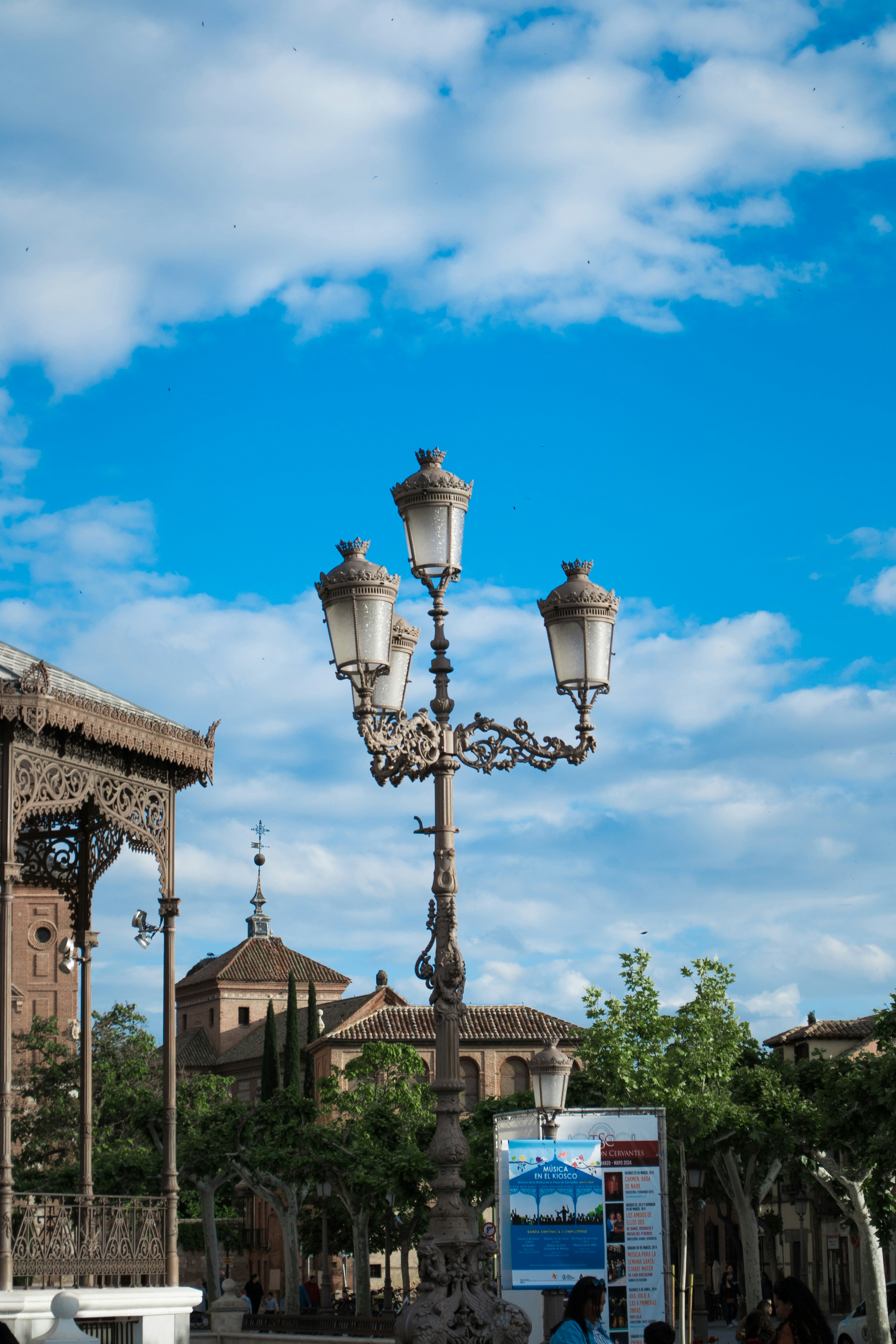 Ornate Lantern Post Framed by a Sunlit Plaza