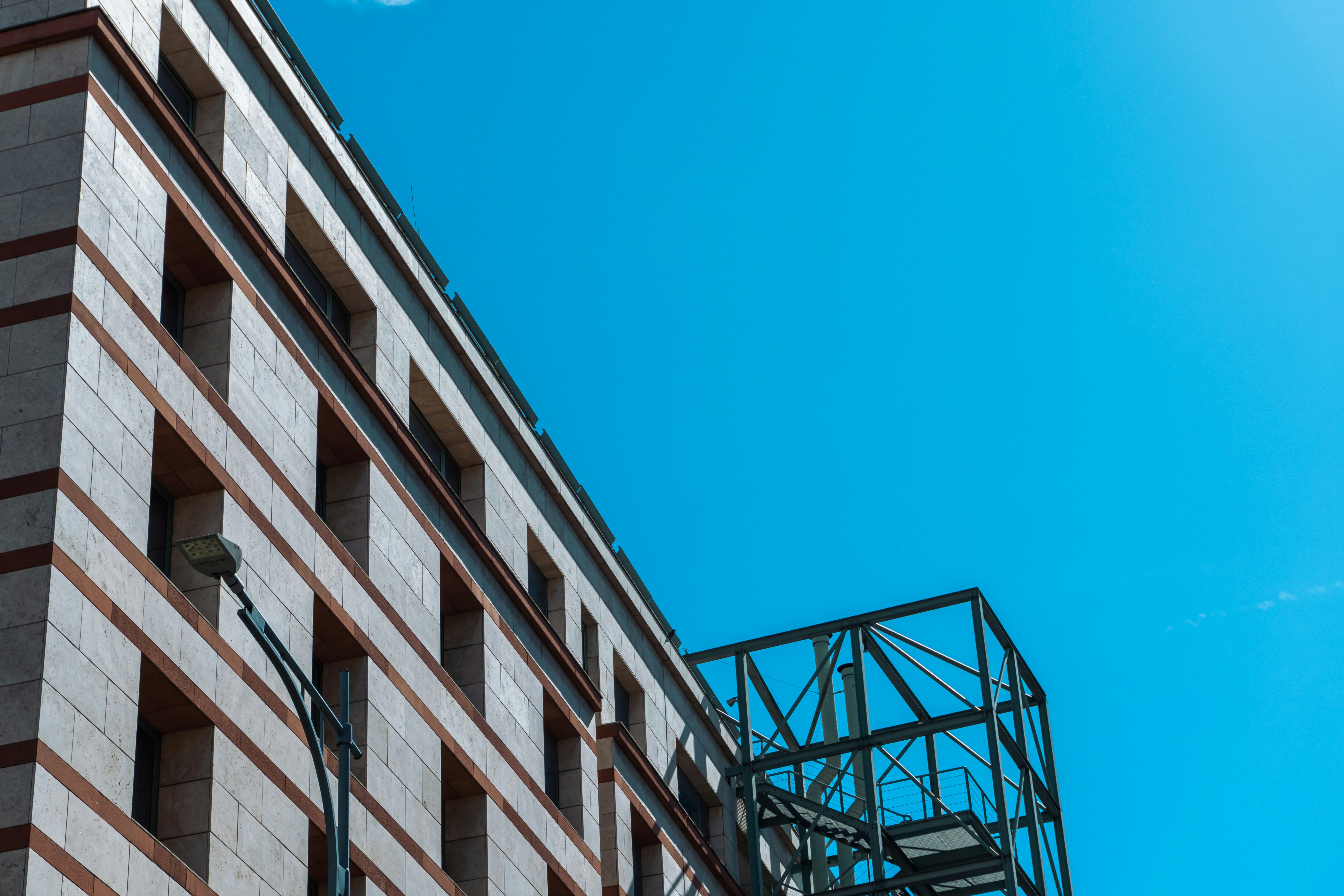 Ridge and Sky: The Diagonal Facade Reaching for Blue