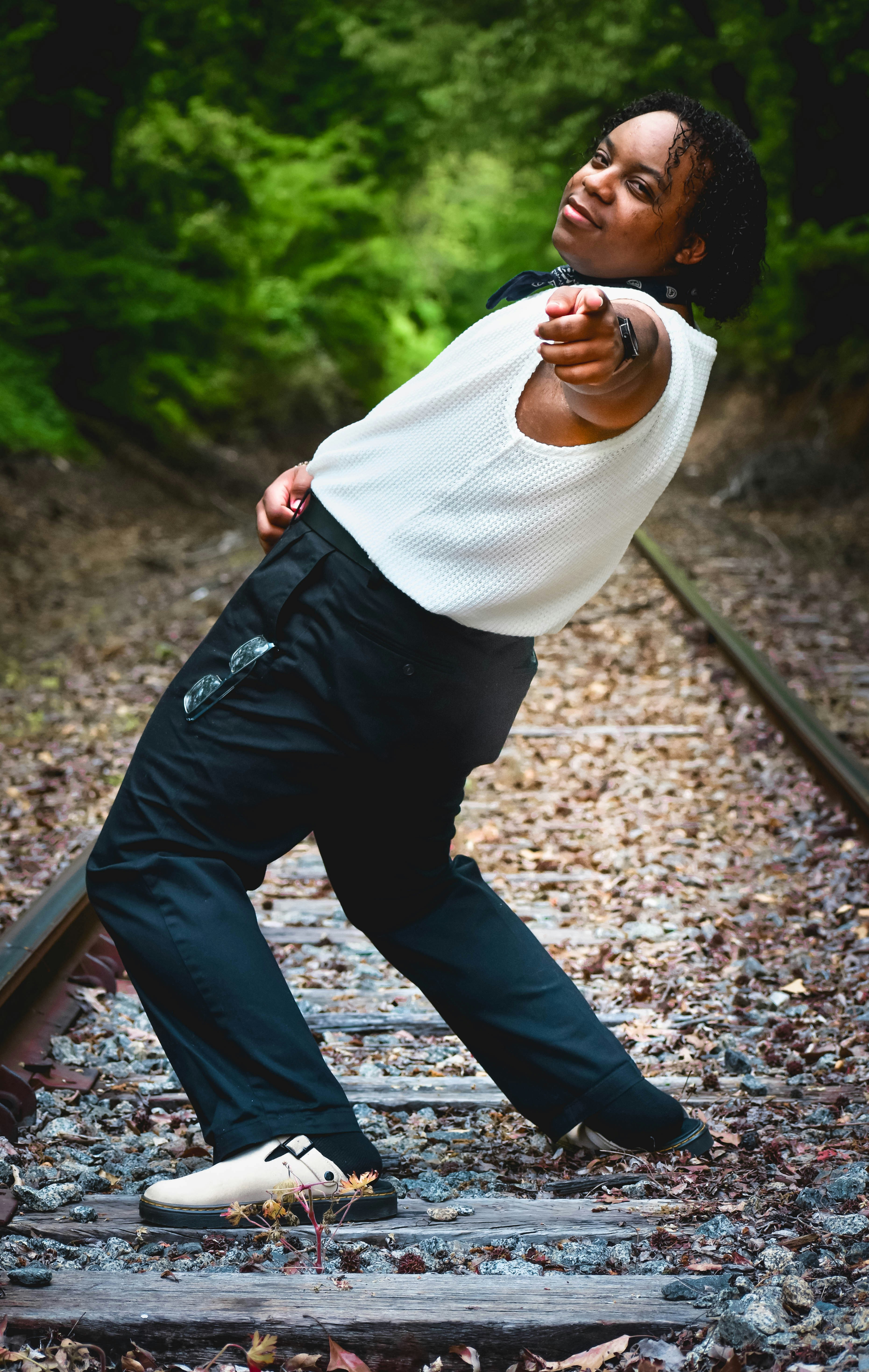 Directed Moment: A Bold Portrait on a Quiet Railroad