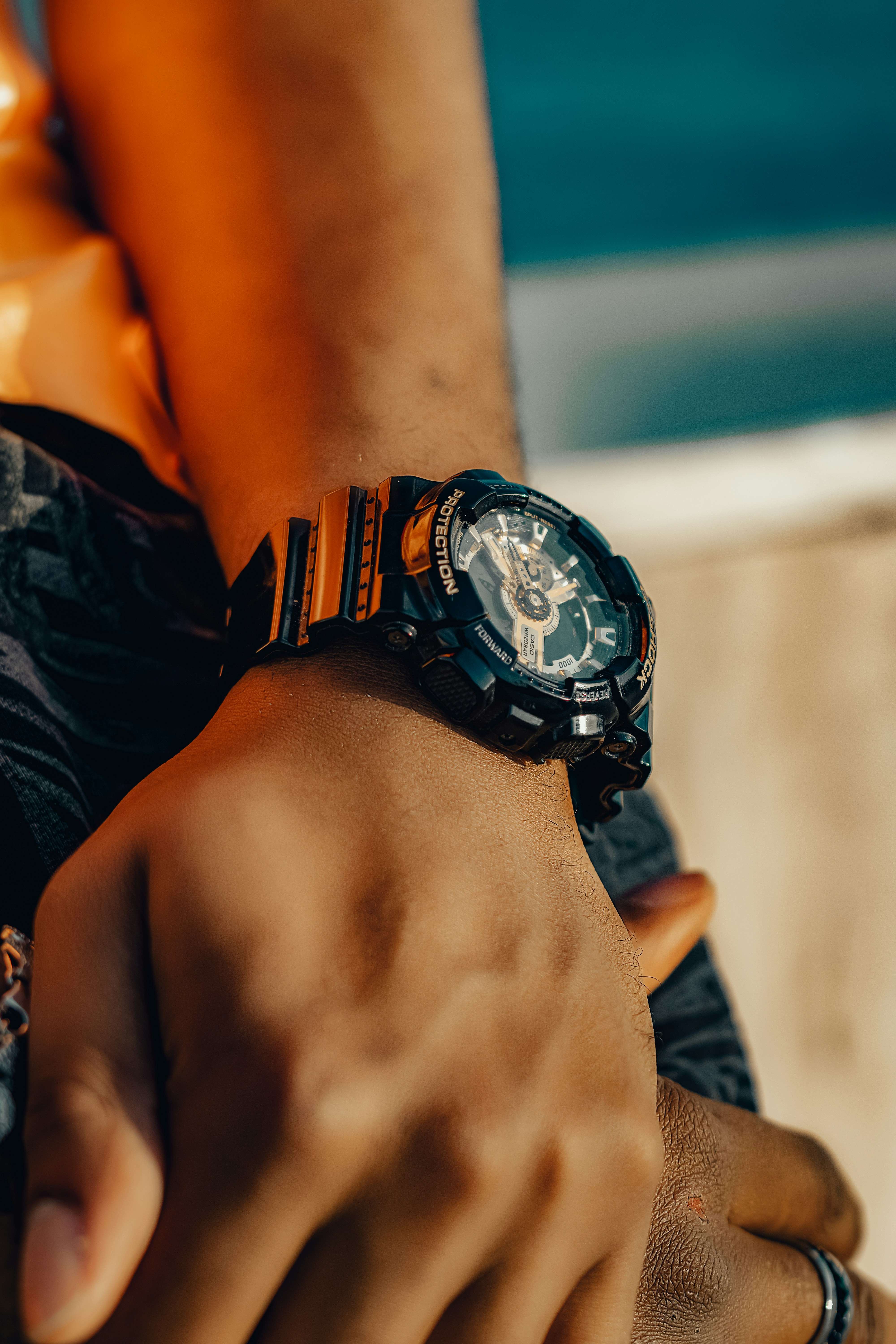 Orange Strap, Black Chronograph: A Close-Up Snapshot of a Rugged Sports Watch