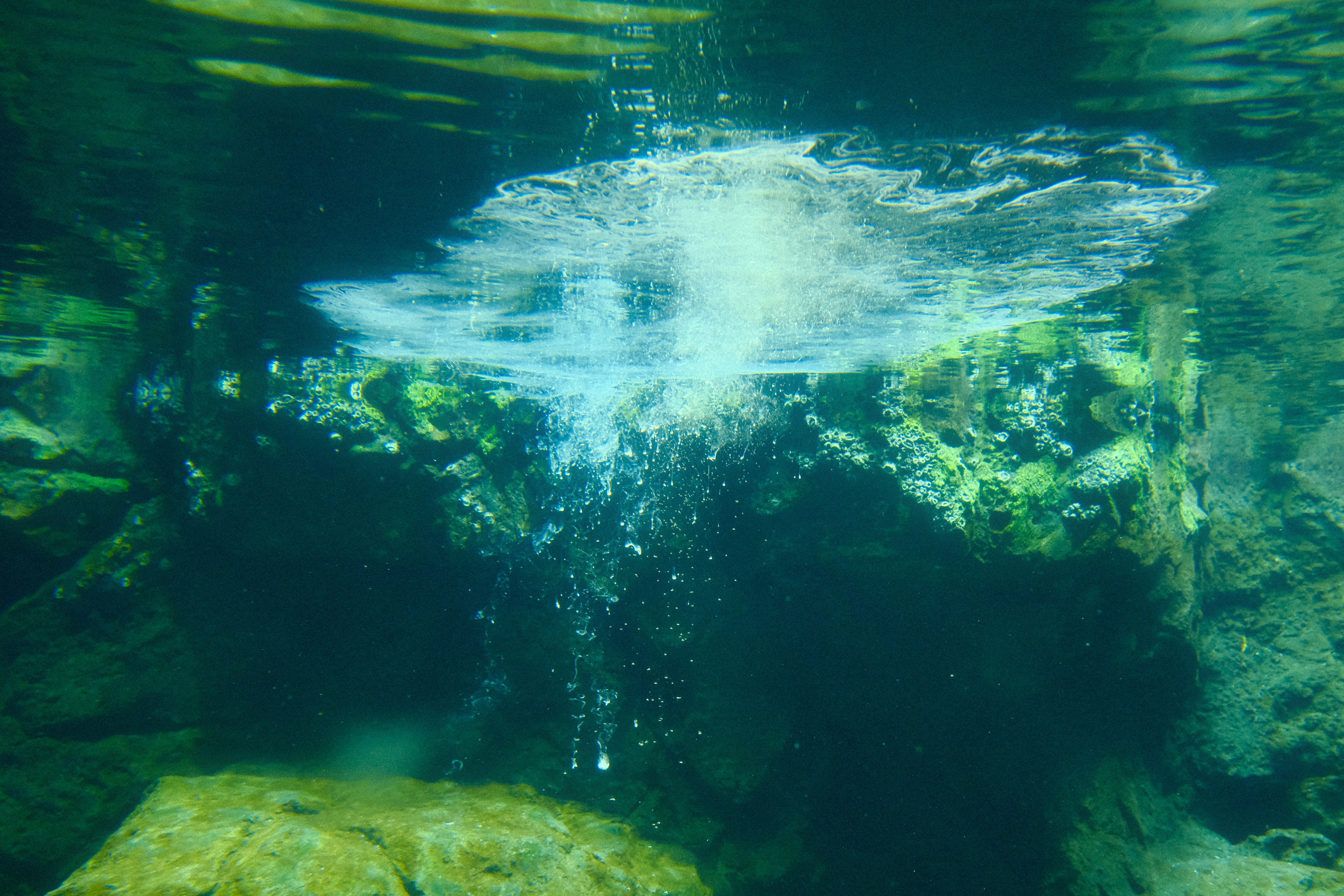 An underwater view of a rock formation in the water photo – Free Sea ...