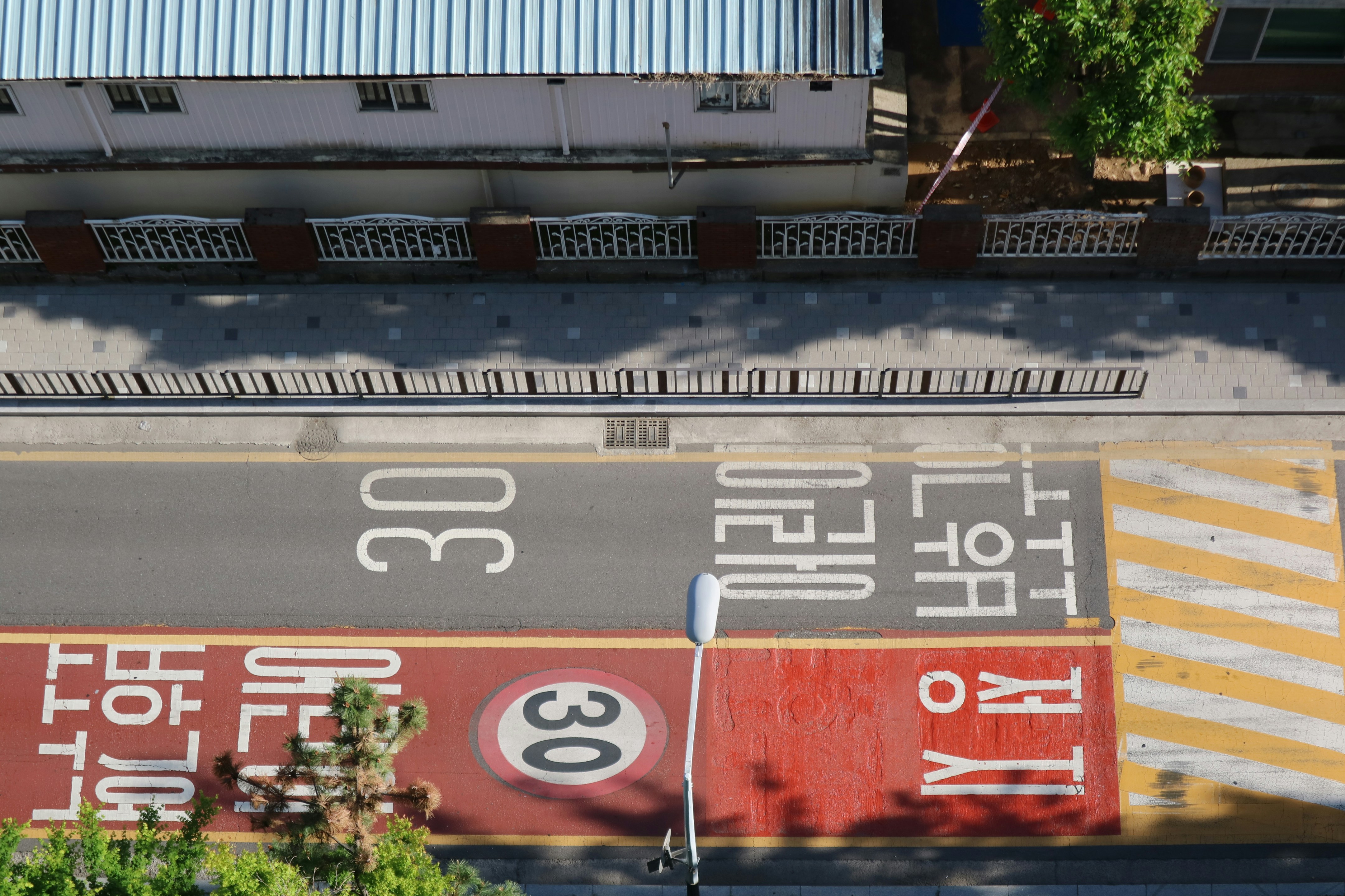 An overhead view of a street with a bus stop sign photo – Free Road ...