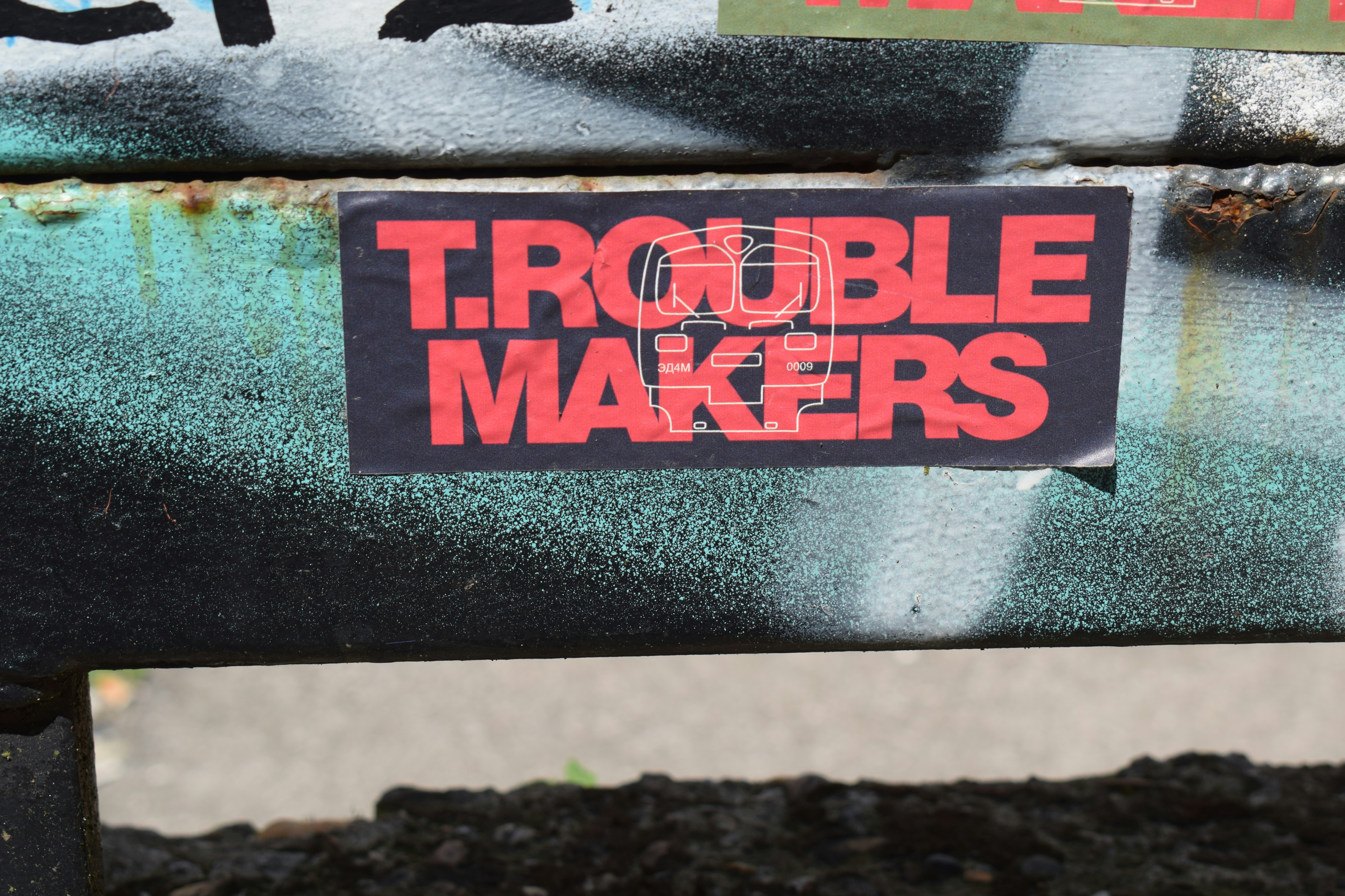 A sticker on a bench that says trouble makers photo – Free Sticker ...
