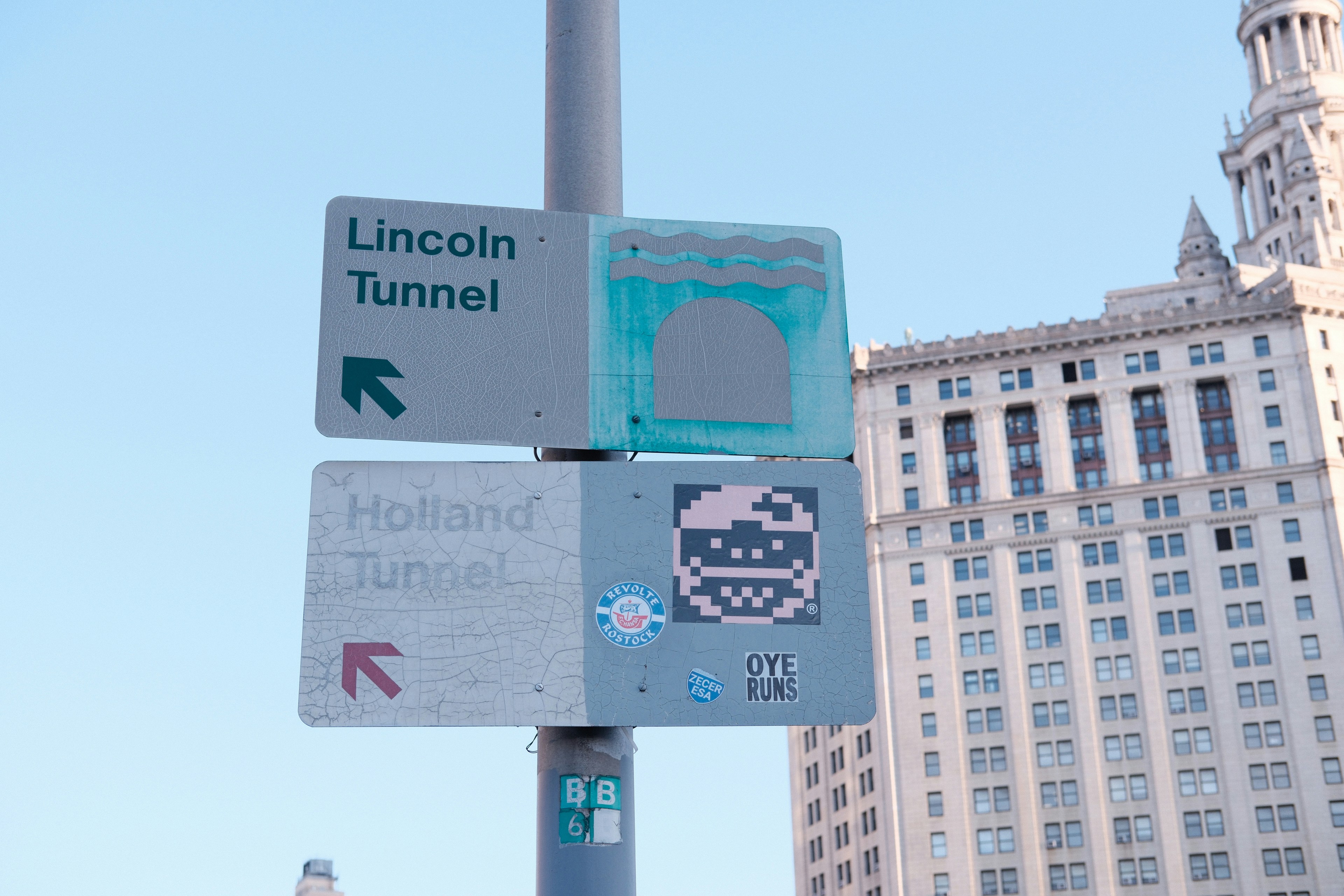 a pole with a bunch of street signs on it