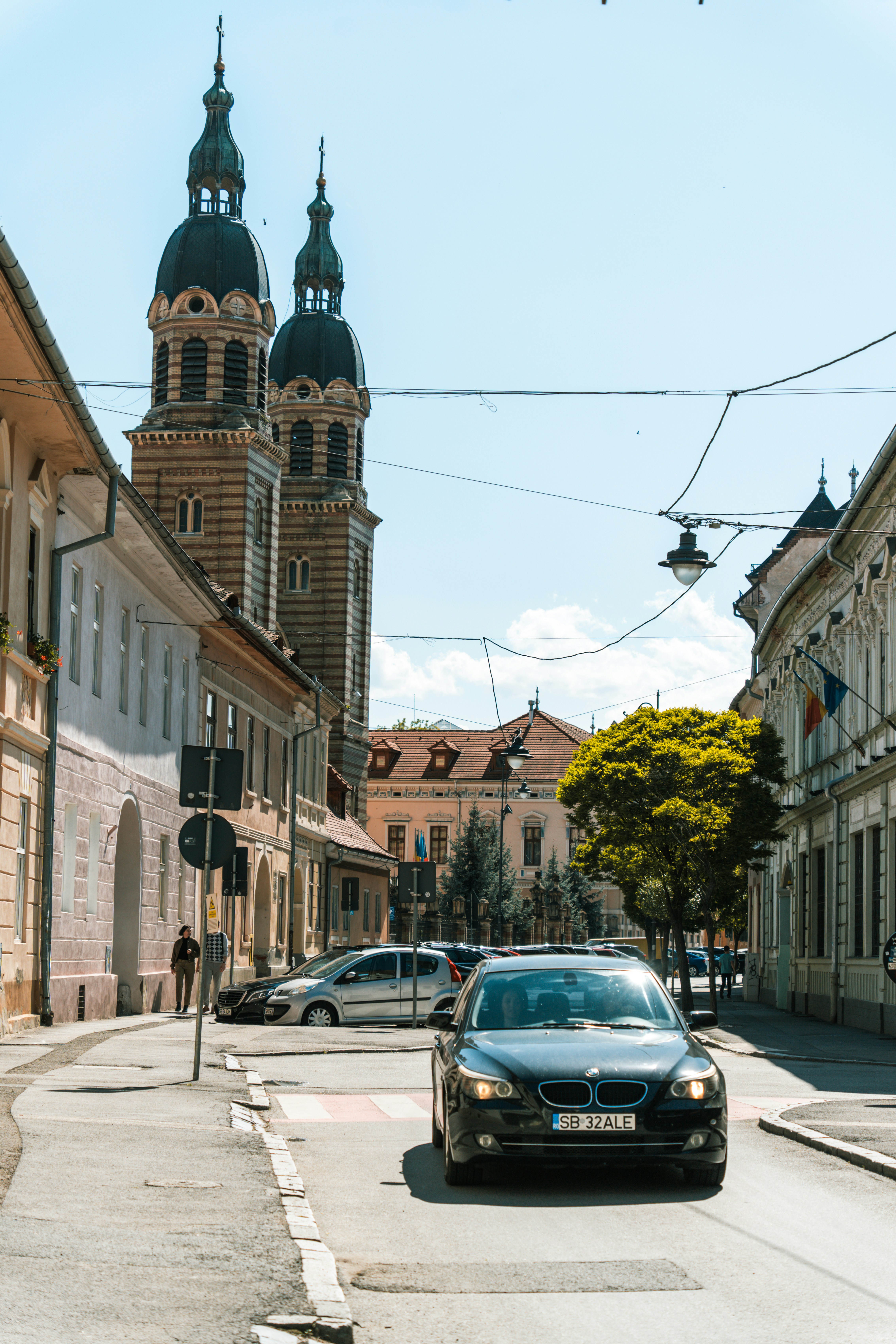 Street Scene Beneath Twin Bell Towers