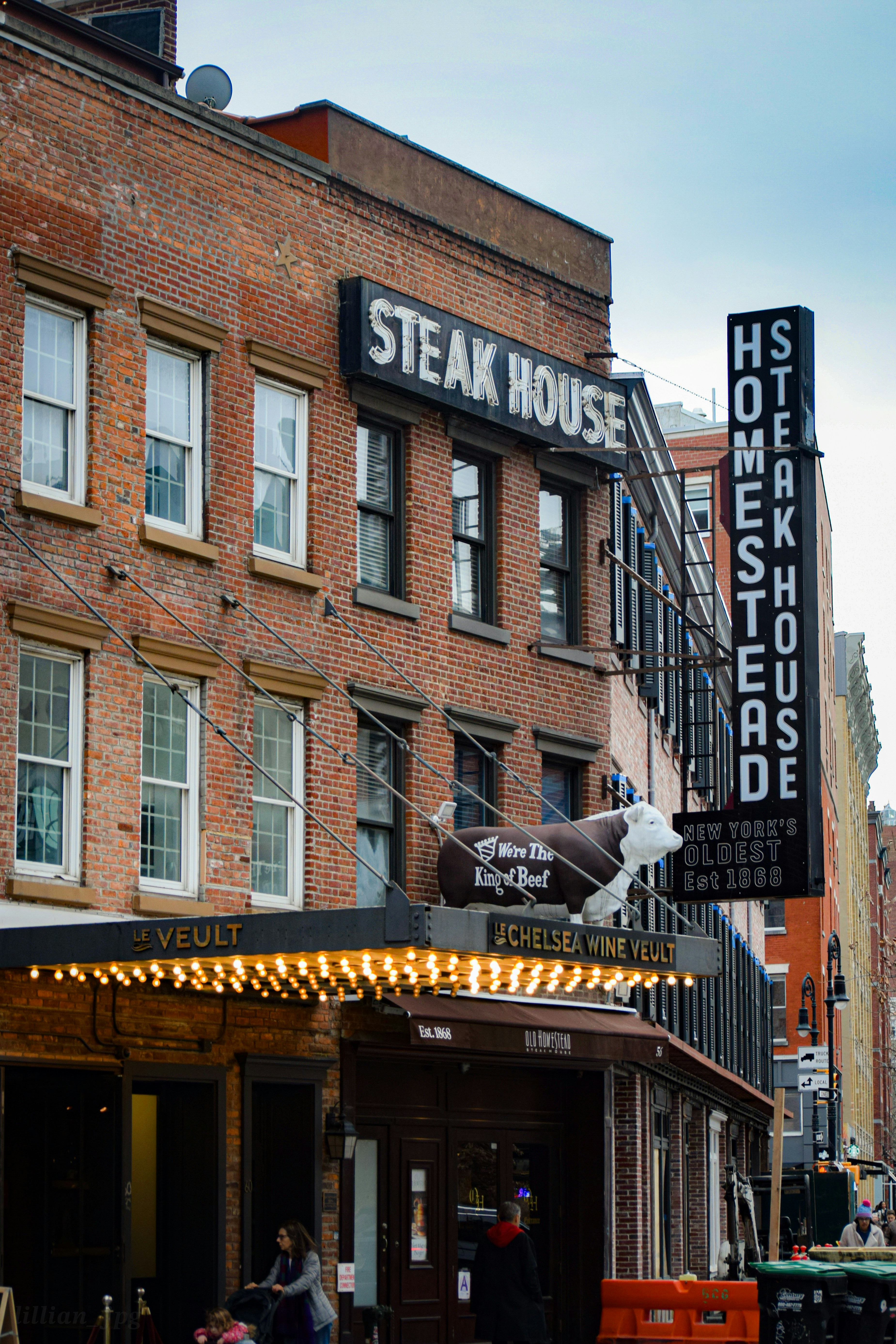 Brick Facades and Neon Signage: The Steak House Above a Vintage Marquee