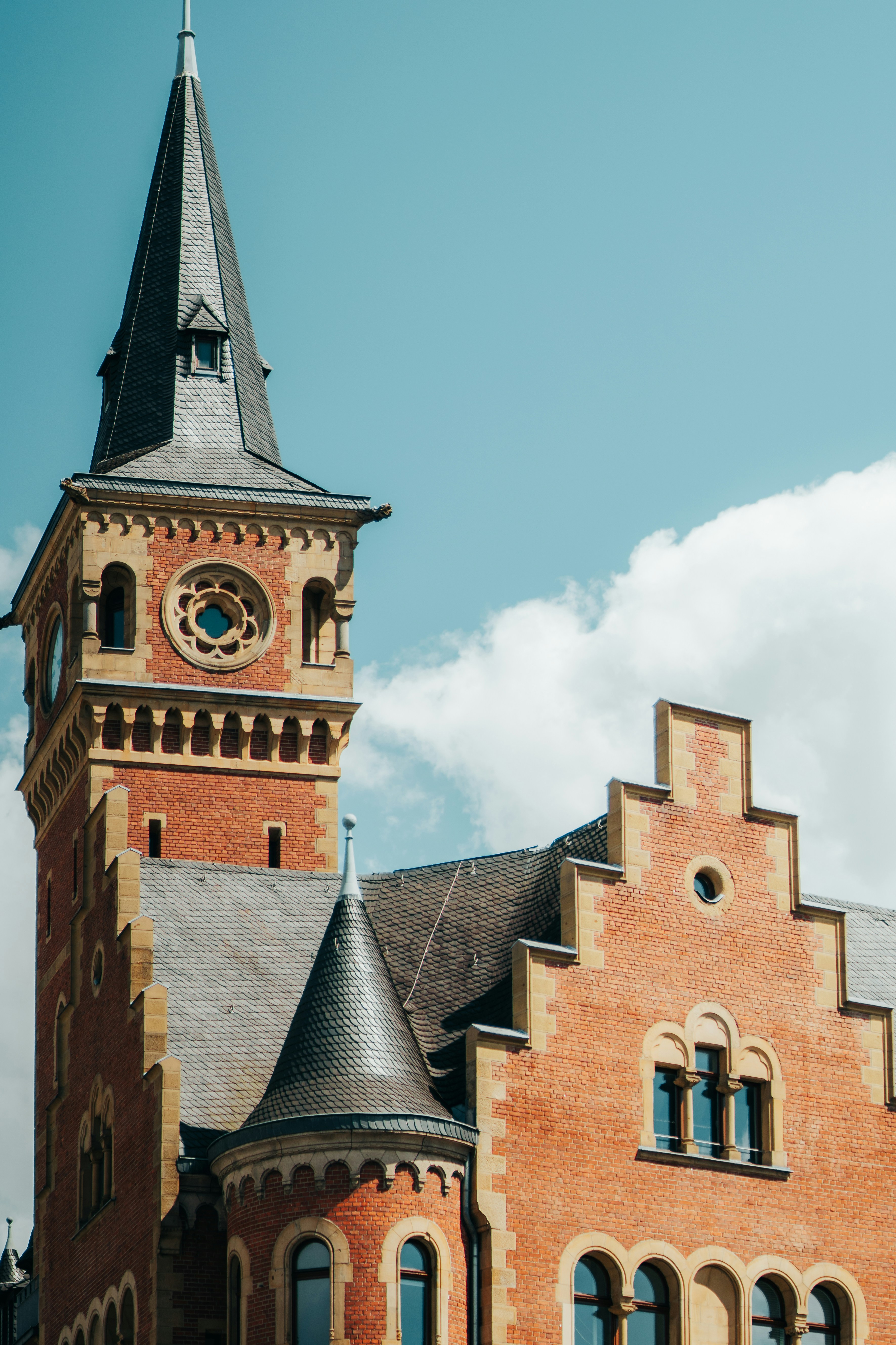 A tall brick building with a clock tower photo – Free Cologne Image on ...
