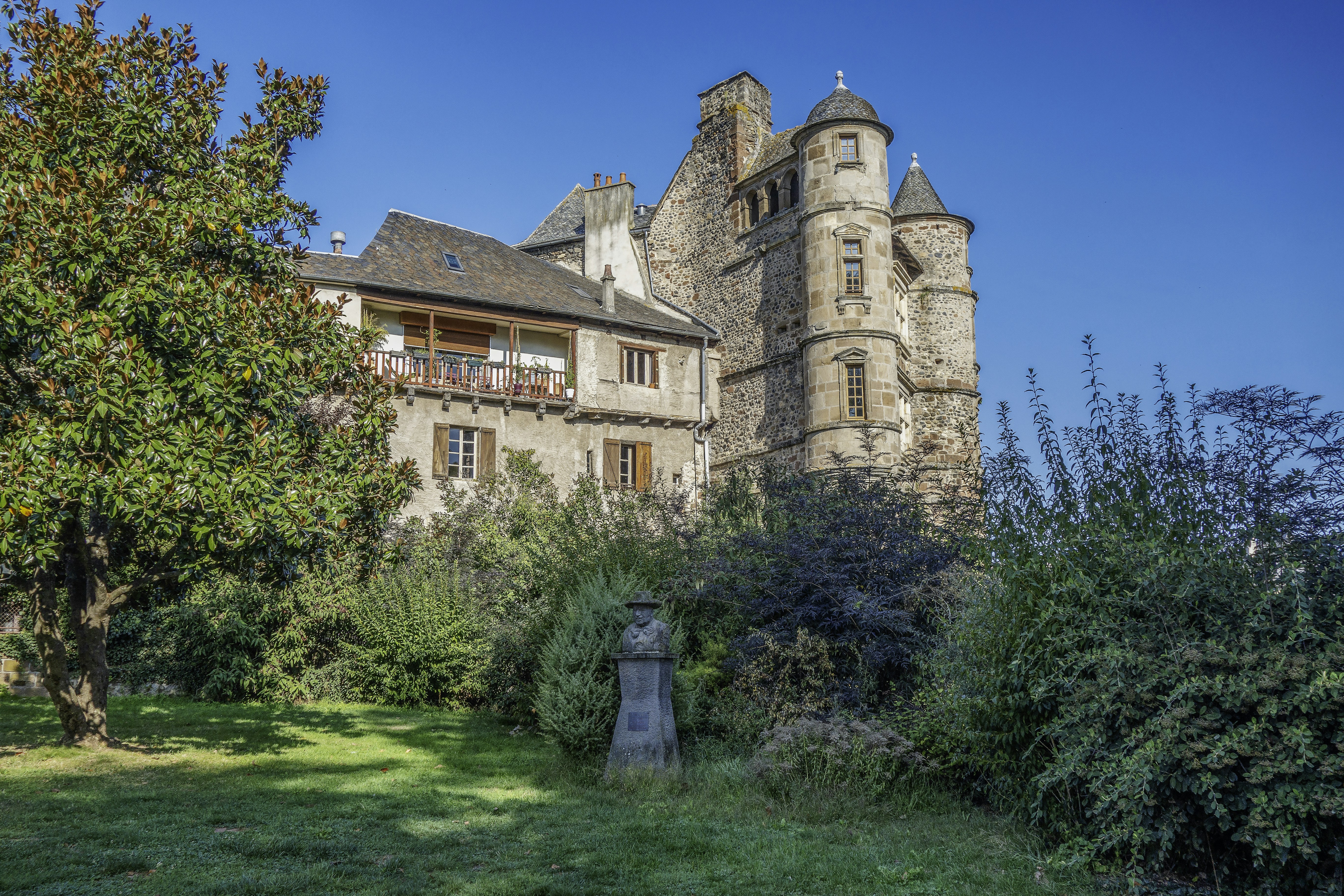 A large castle like building with a tall tower photo – Free Espalion ...