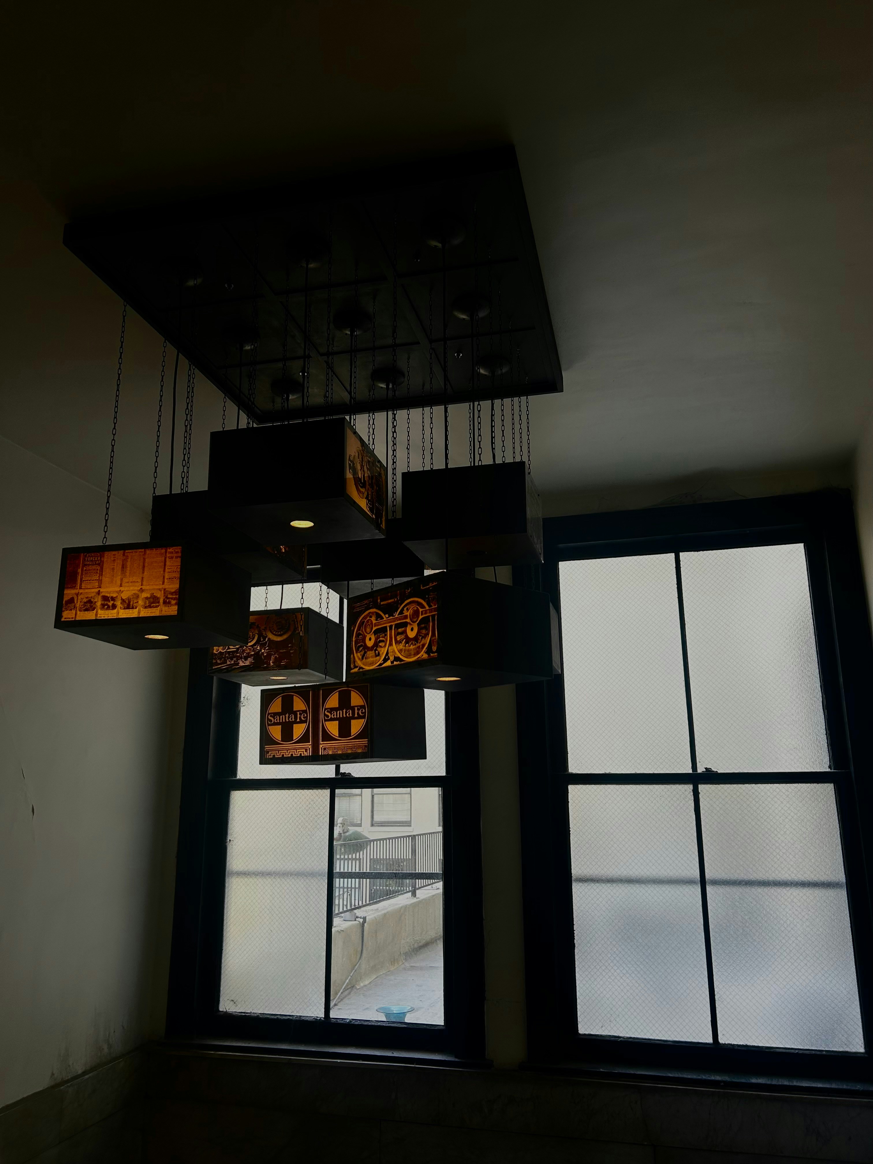 Hanging Lanterns Above a Dim Corridor