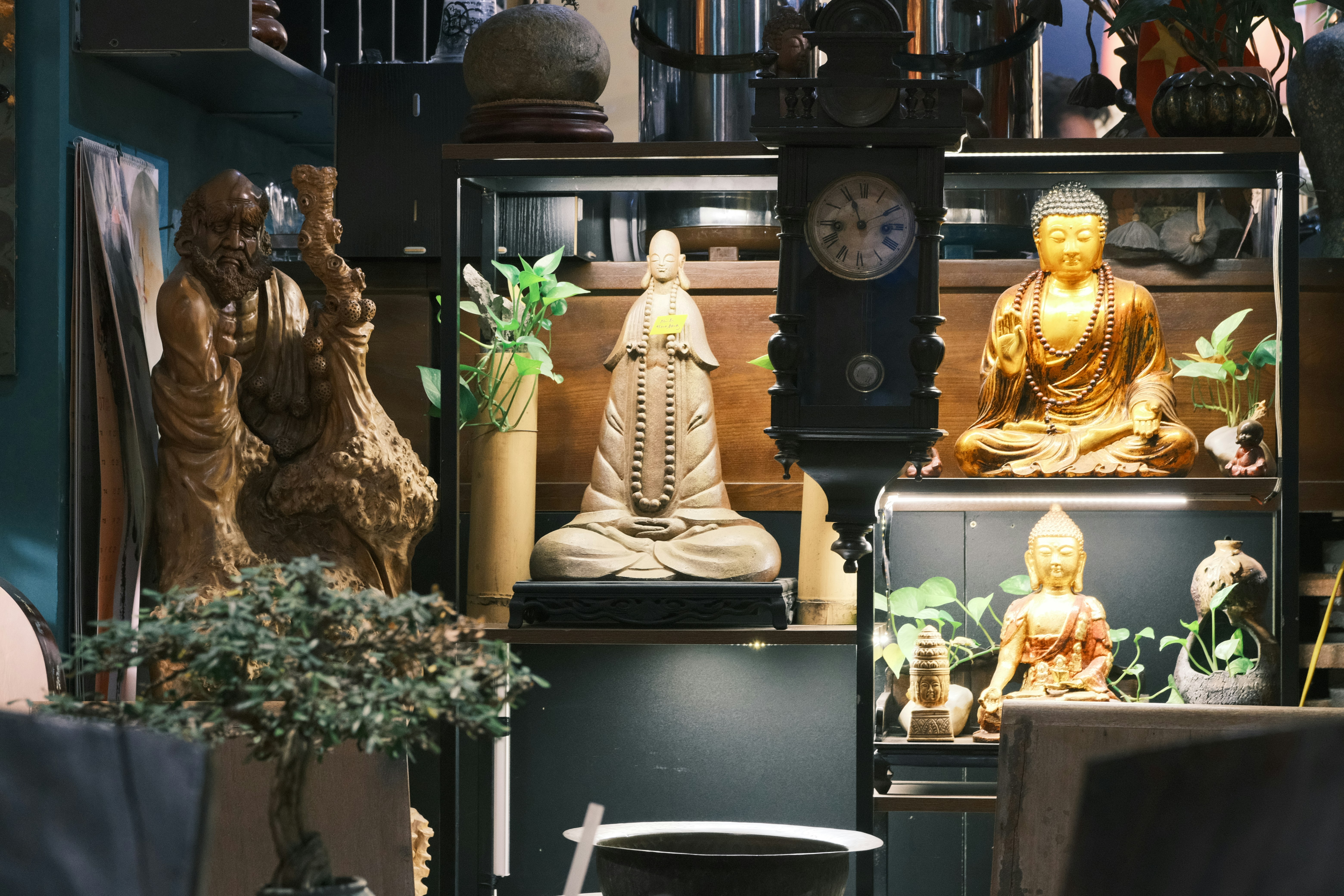 A room filled with lots of different types of statues photo – Free ...