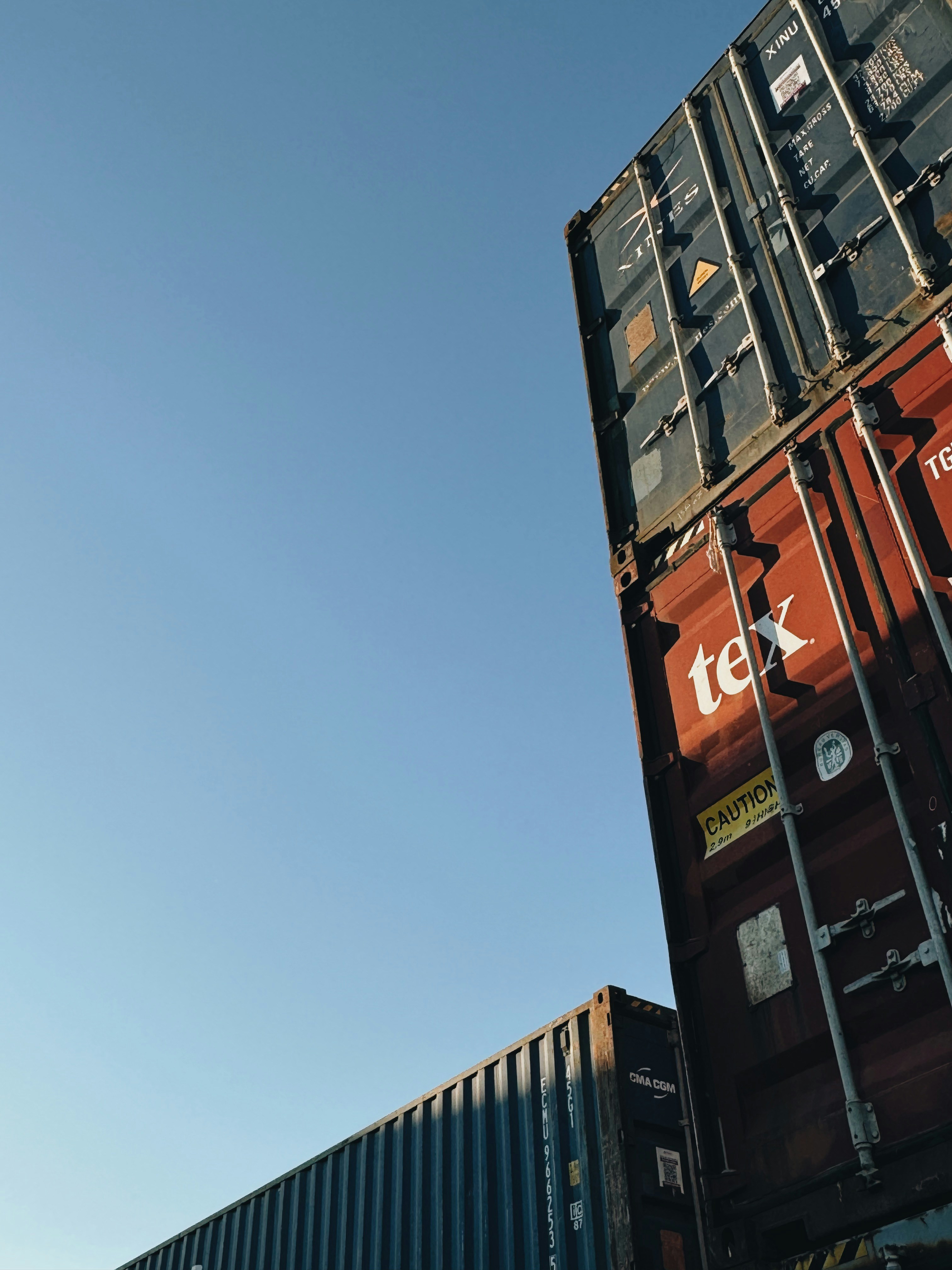 A stack of cargo containers sitting next to each other photo – Free ...