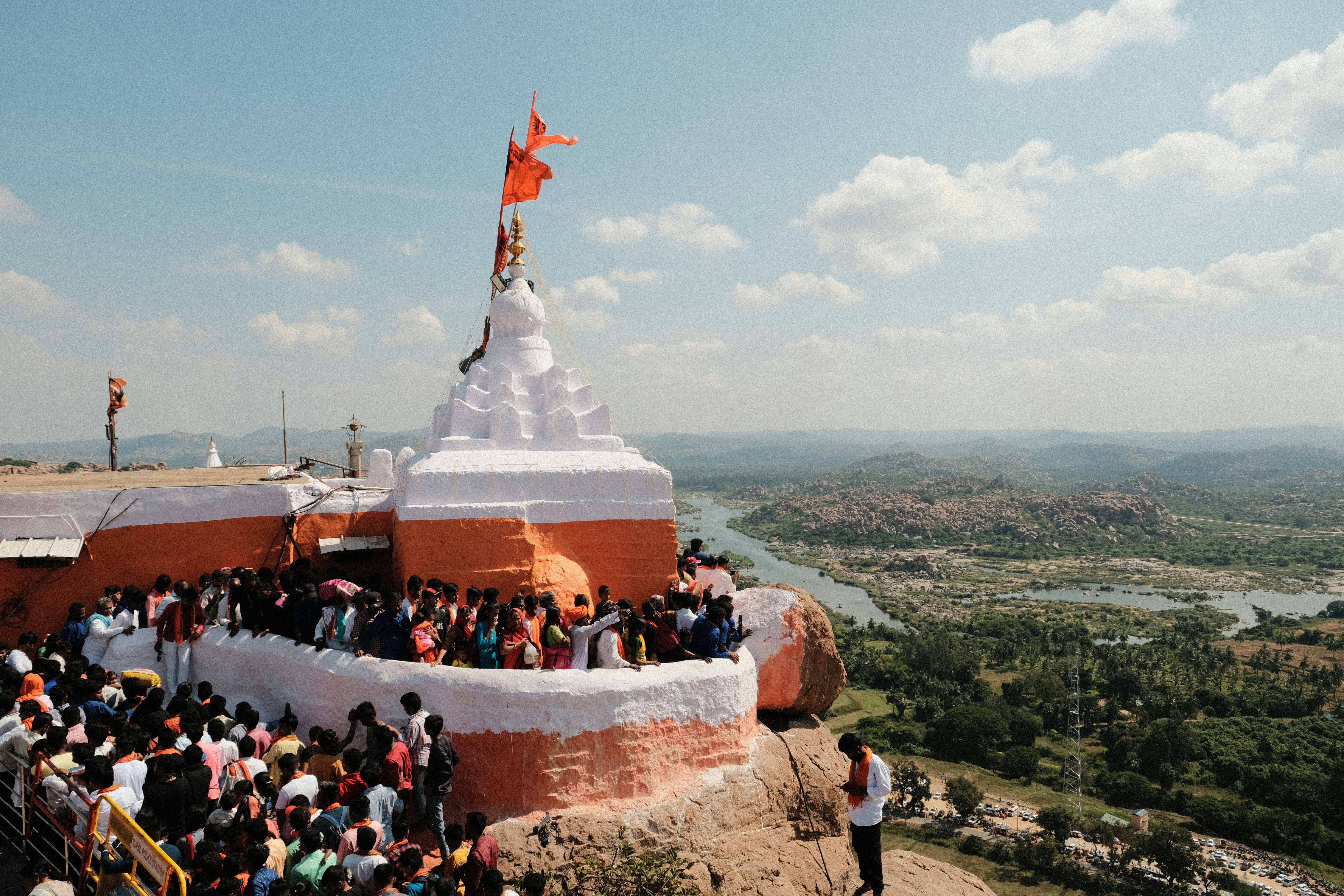 Crest of the Fortress: a white stupa crowns a sunlit overlook above the patchwork valley