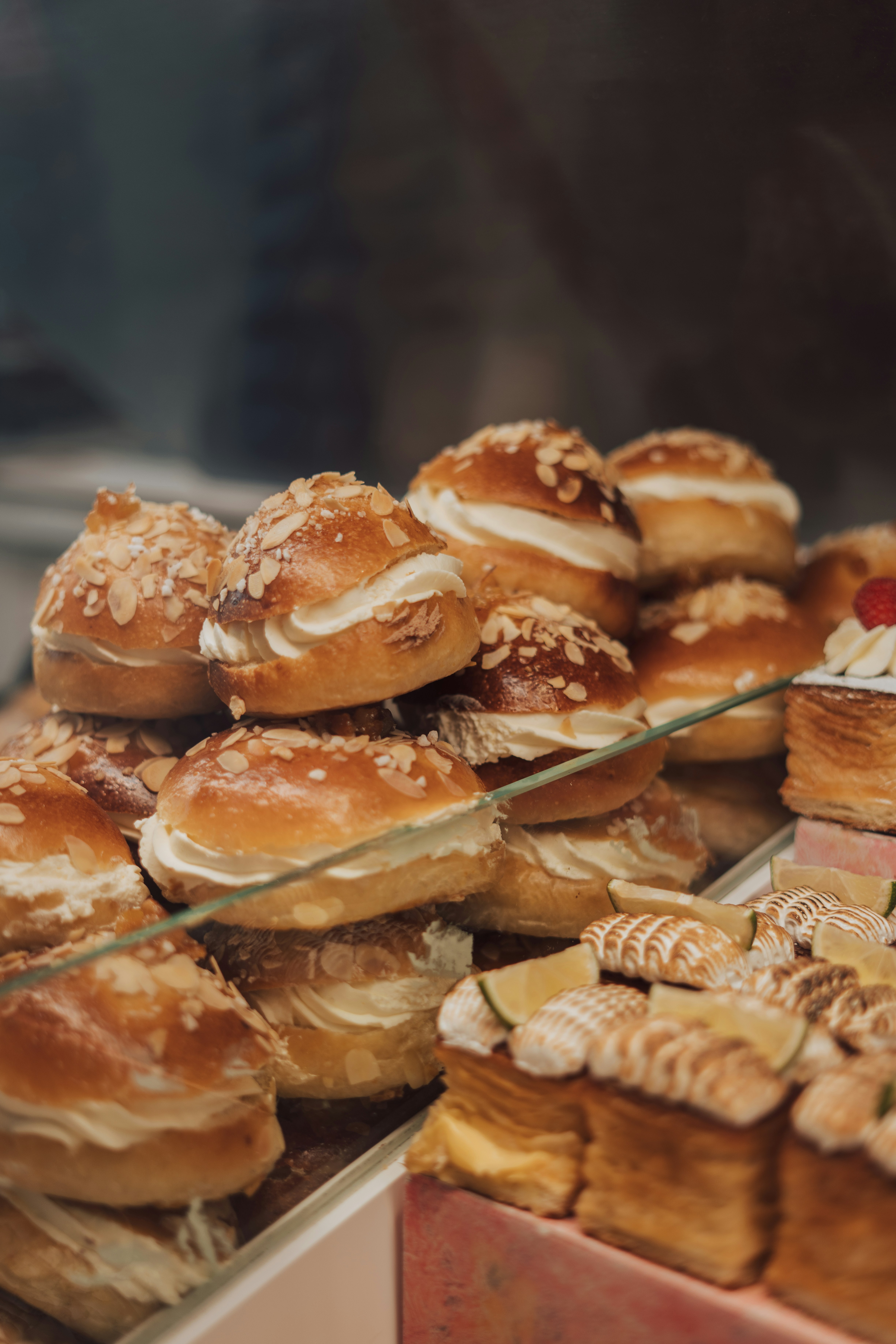A display case filled with lots of different types of pastries photo ...