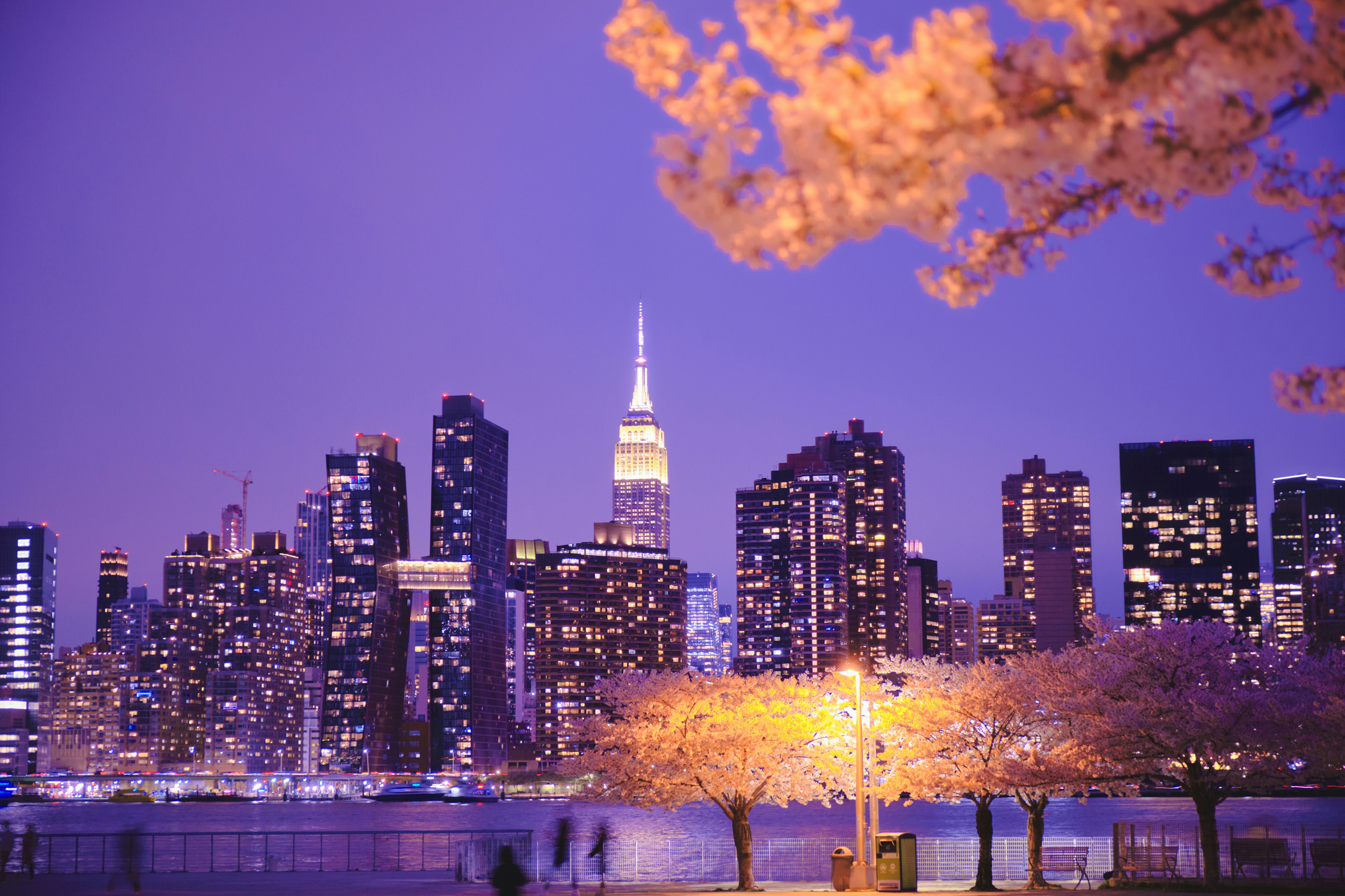 Spire of Neon Over a Purple Hour: Empire State at the Hudson