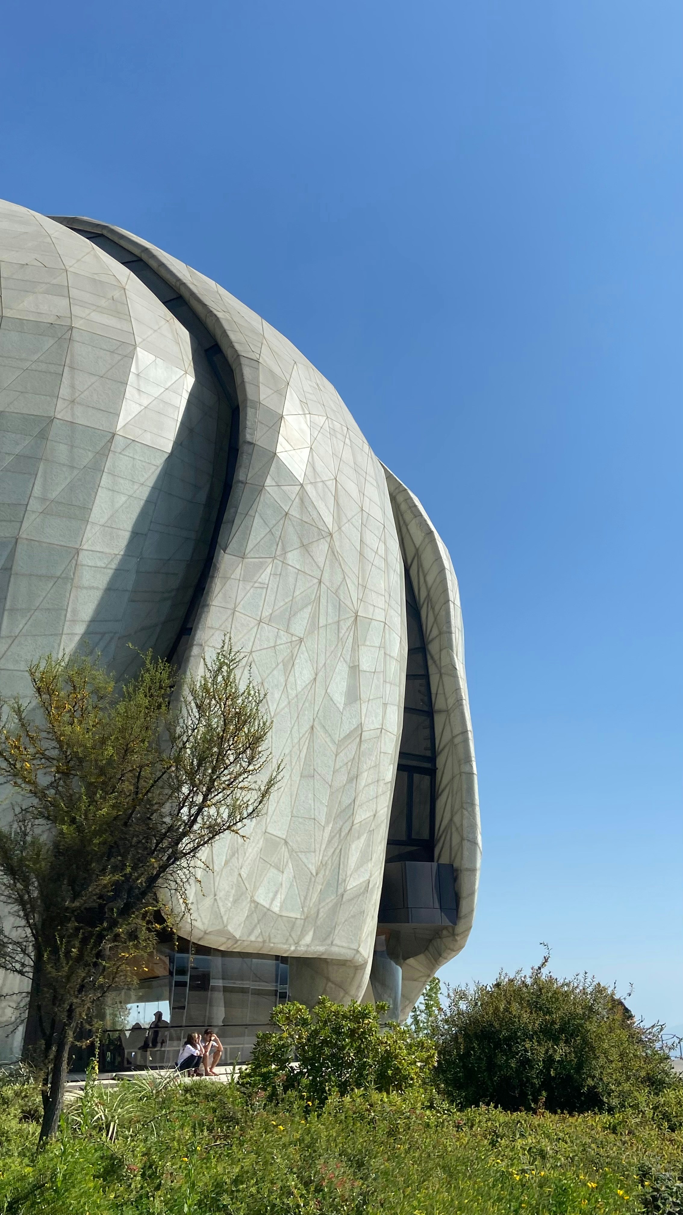 Curved Concrete Dome Against a Cerulean Sky