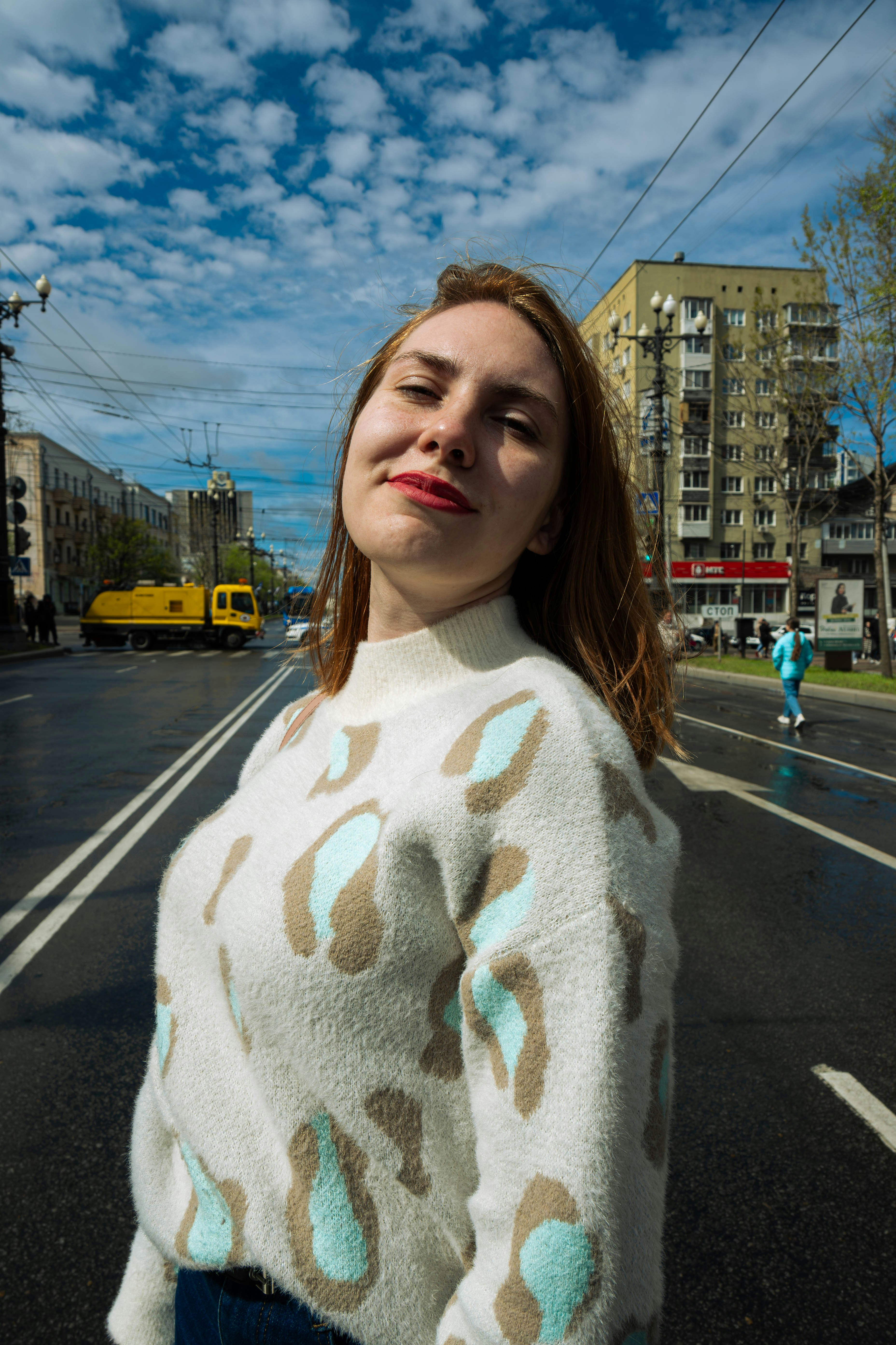 City Stroll: A Confident Portrait with a Bright Blue Sky