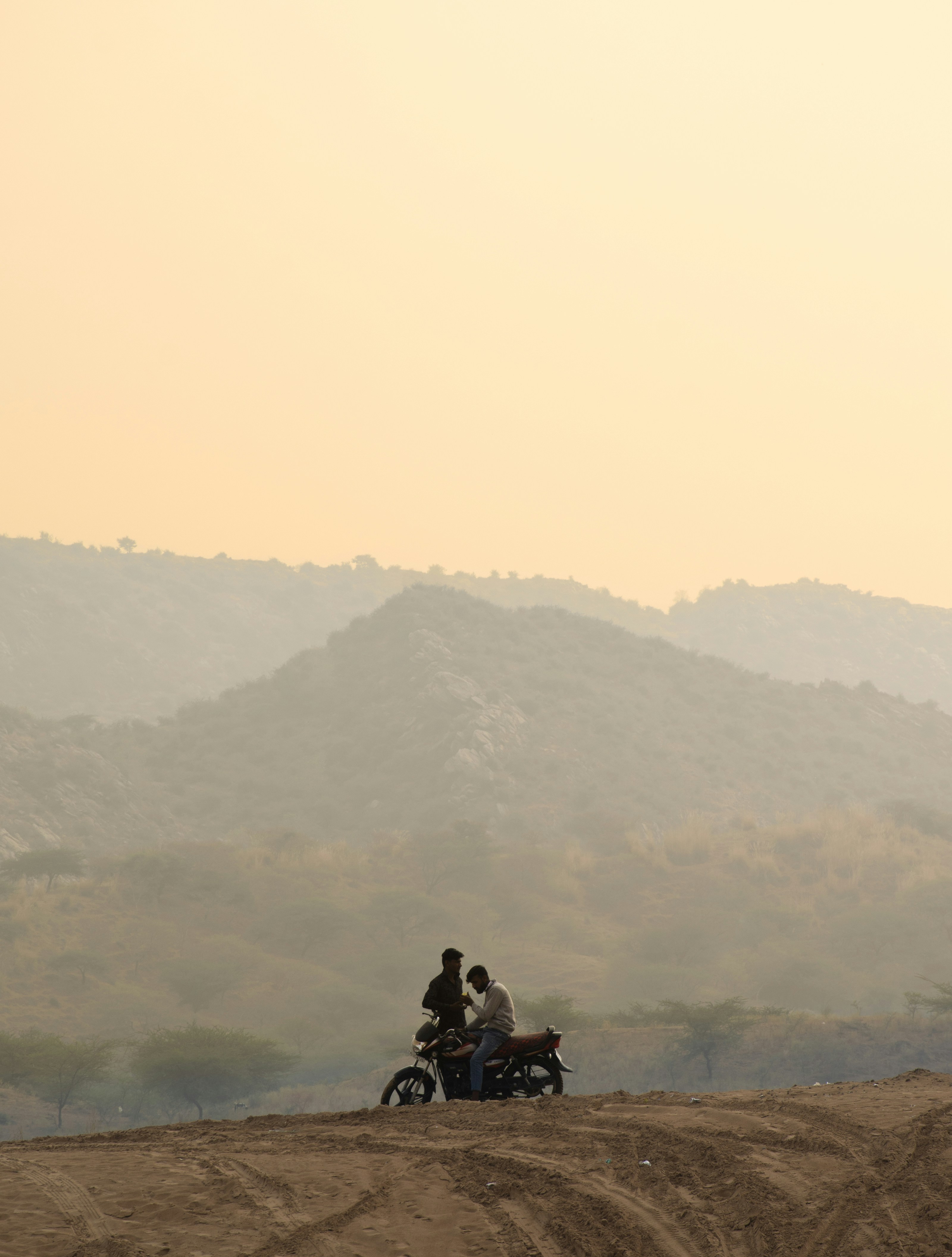 Dusk on the Dust Ridge: Riders Pause at the Horizon
