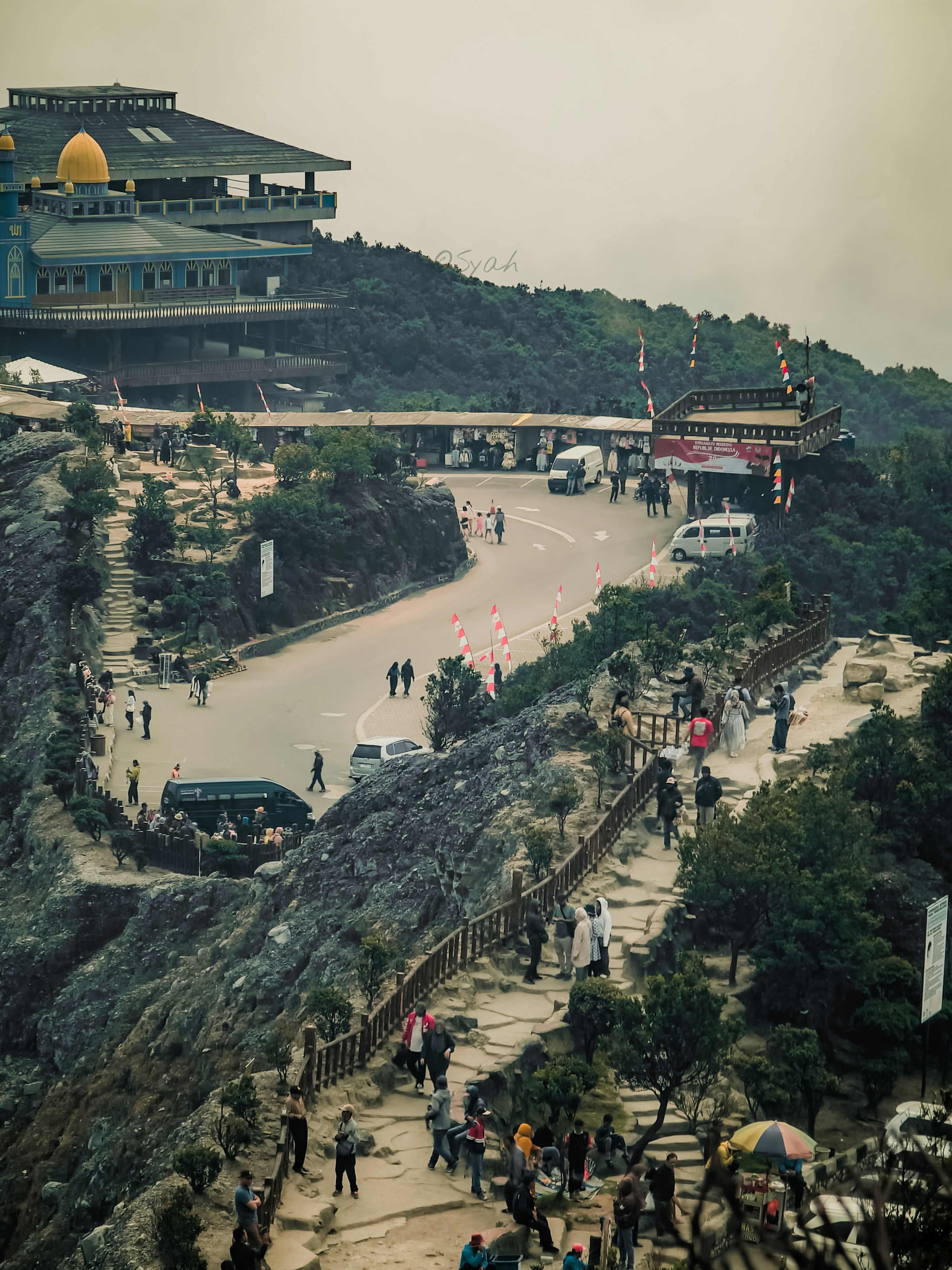 a group of people walking up a steep hill