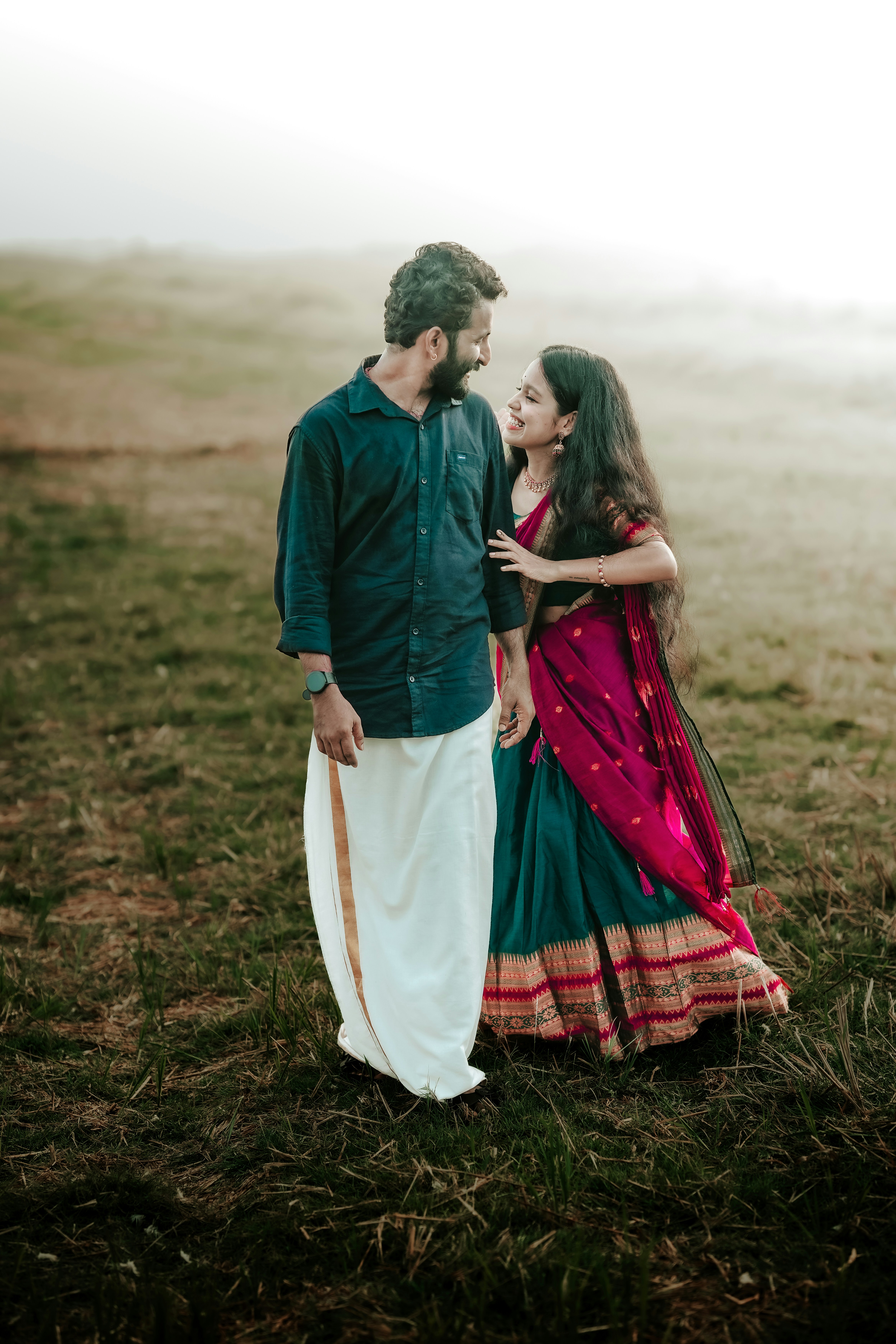 A man and a woman standing in a field photo – Free Thrissur Image on ...