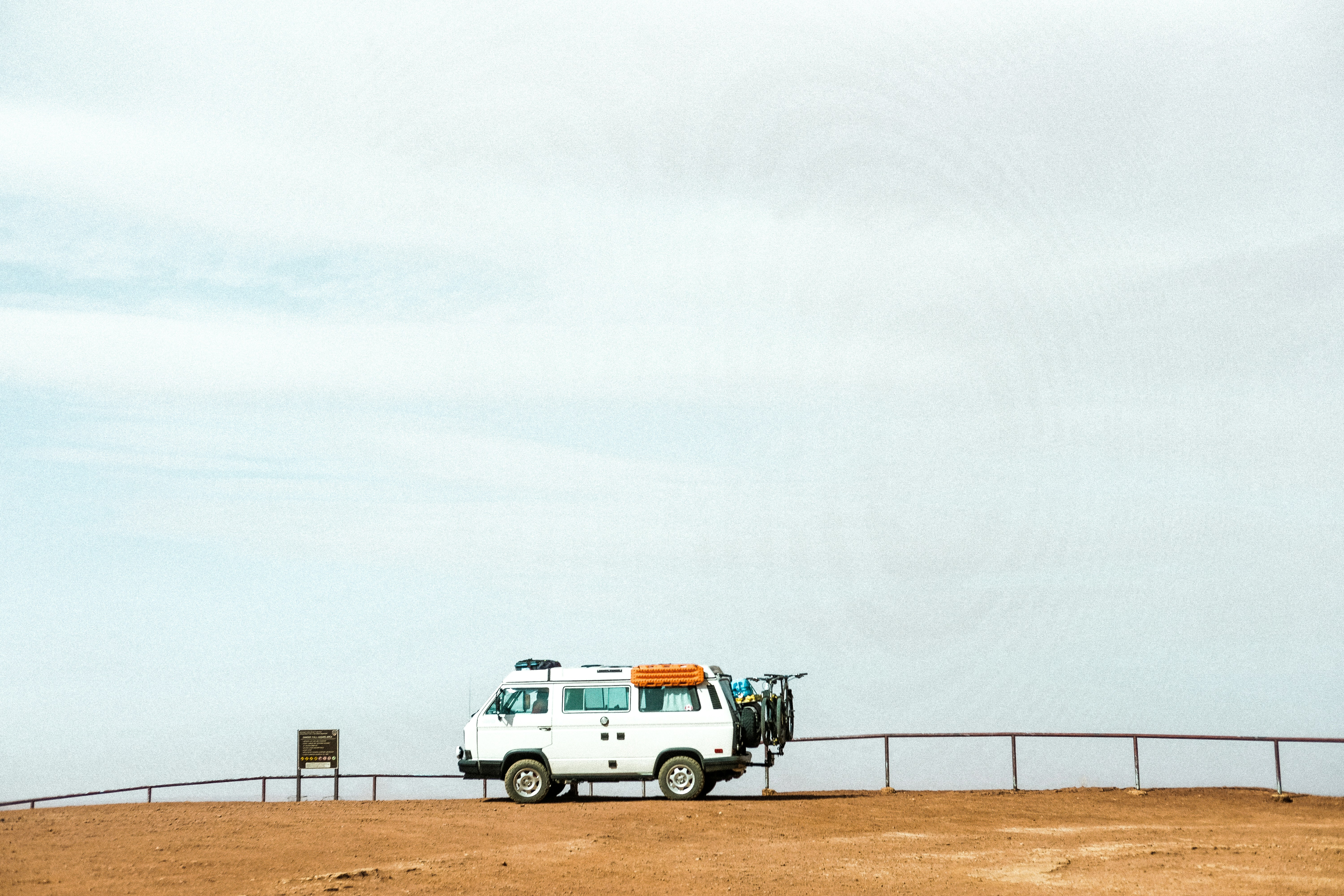 Desert Edge Camper: White Van at the Rim