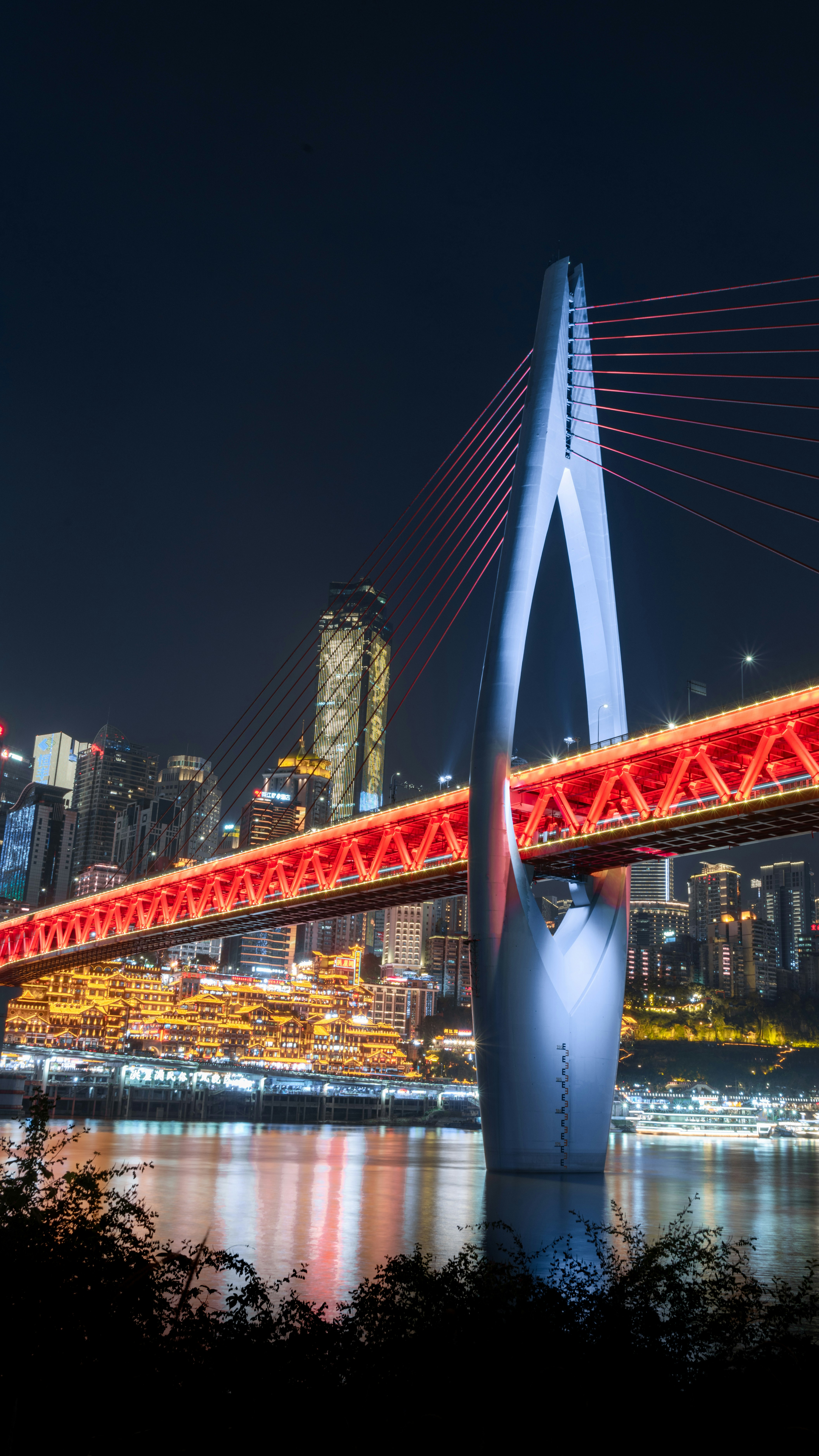 A large red bridge over a body of water photo – Free Urban Image on ...