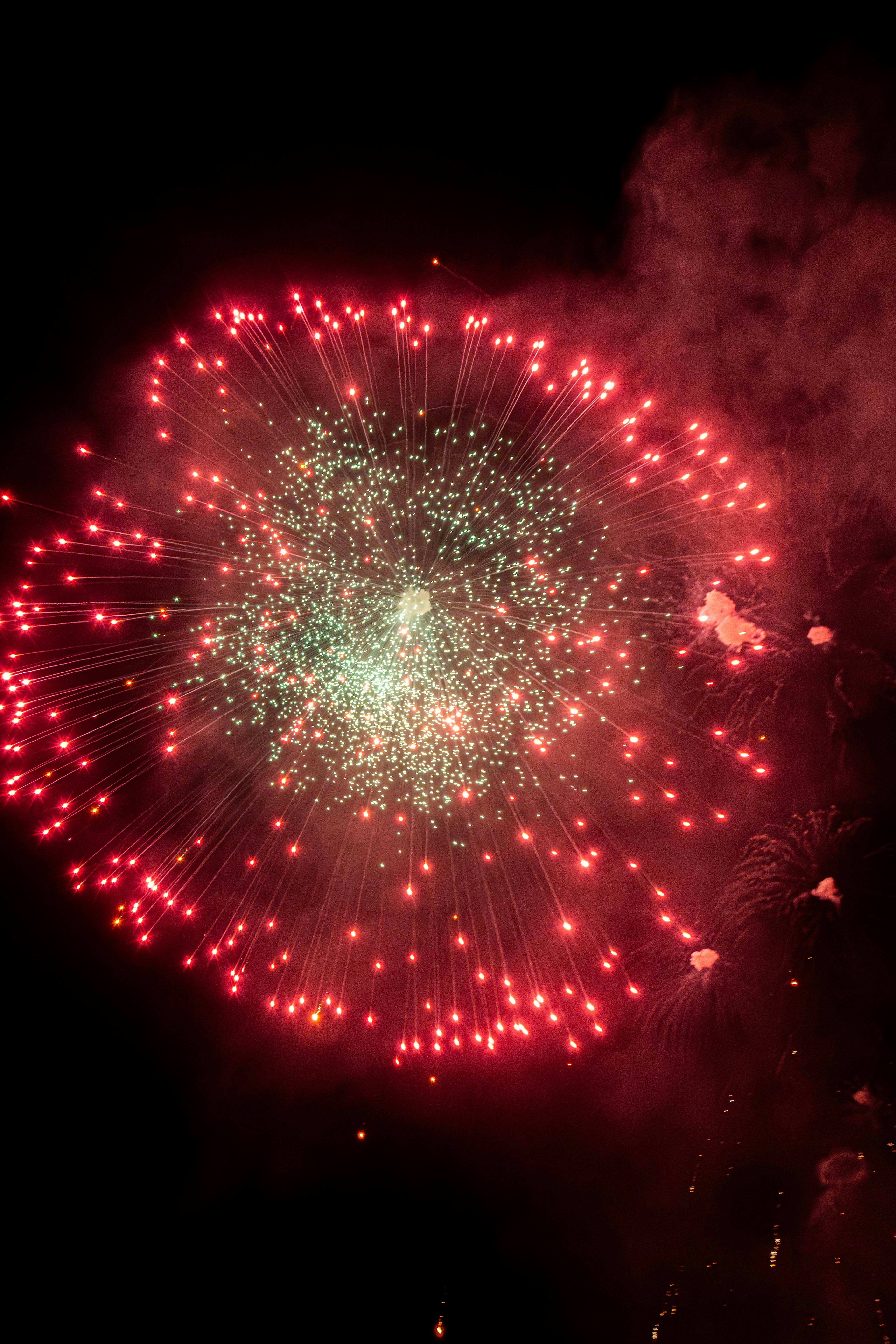A large fireworks is lit up in the night sky photo – Free Fireworks ...