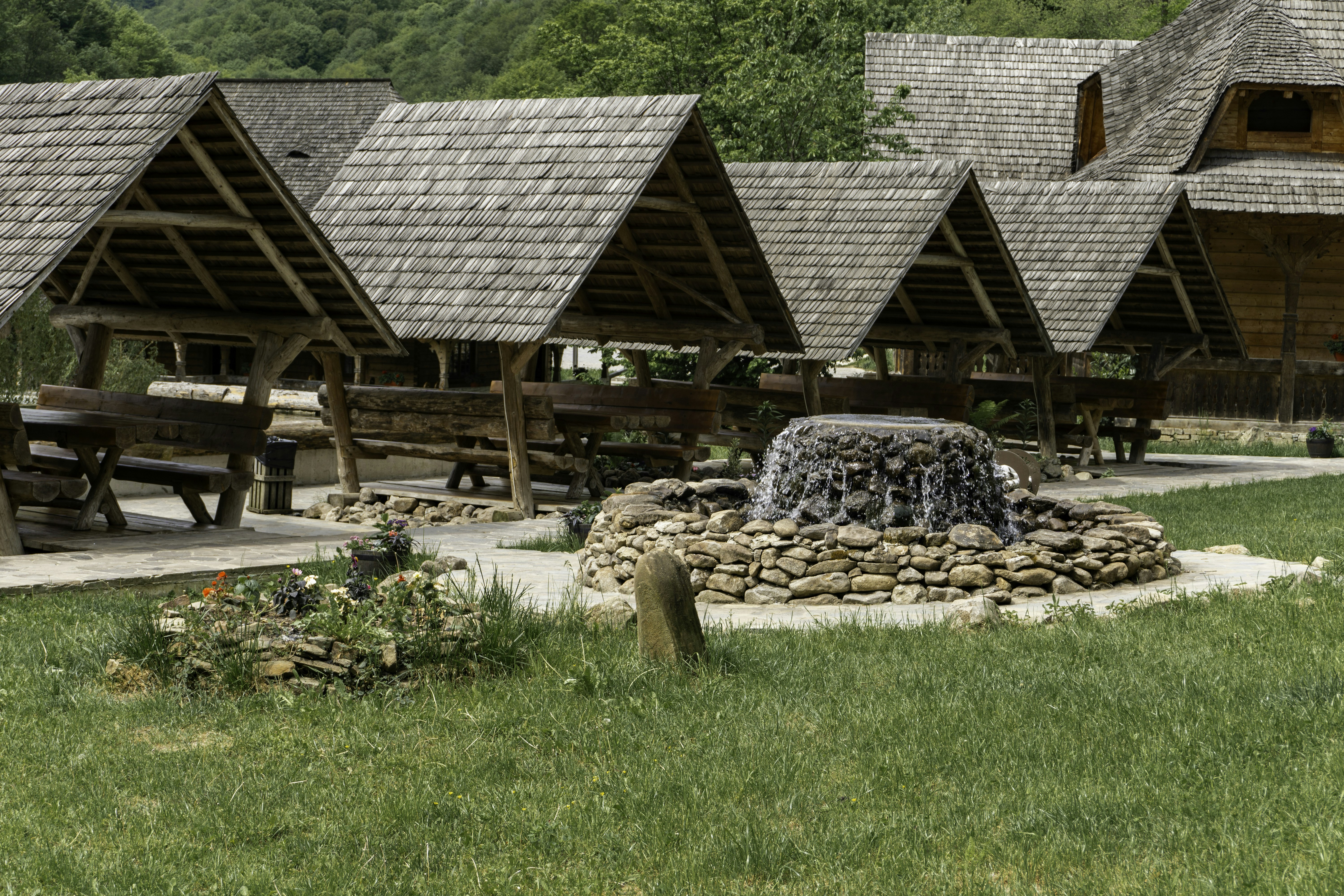 Stone Well at the Heart of a Rustic Village Grove