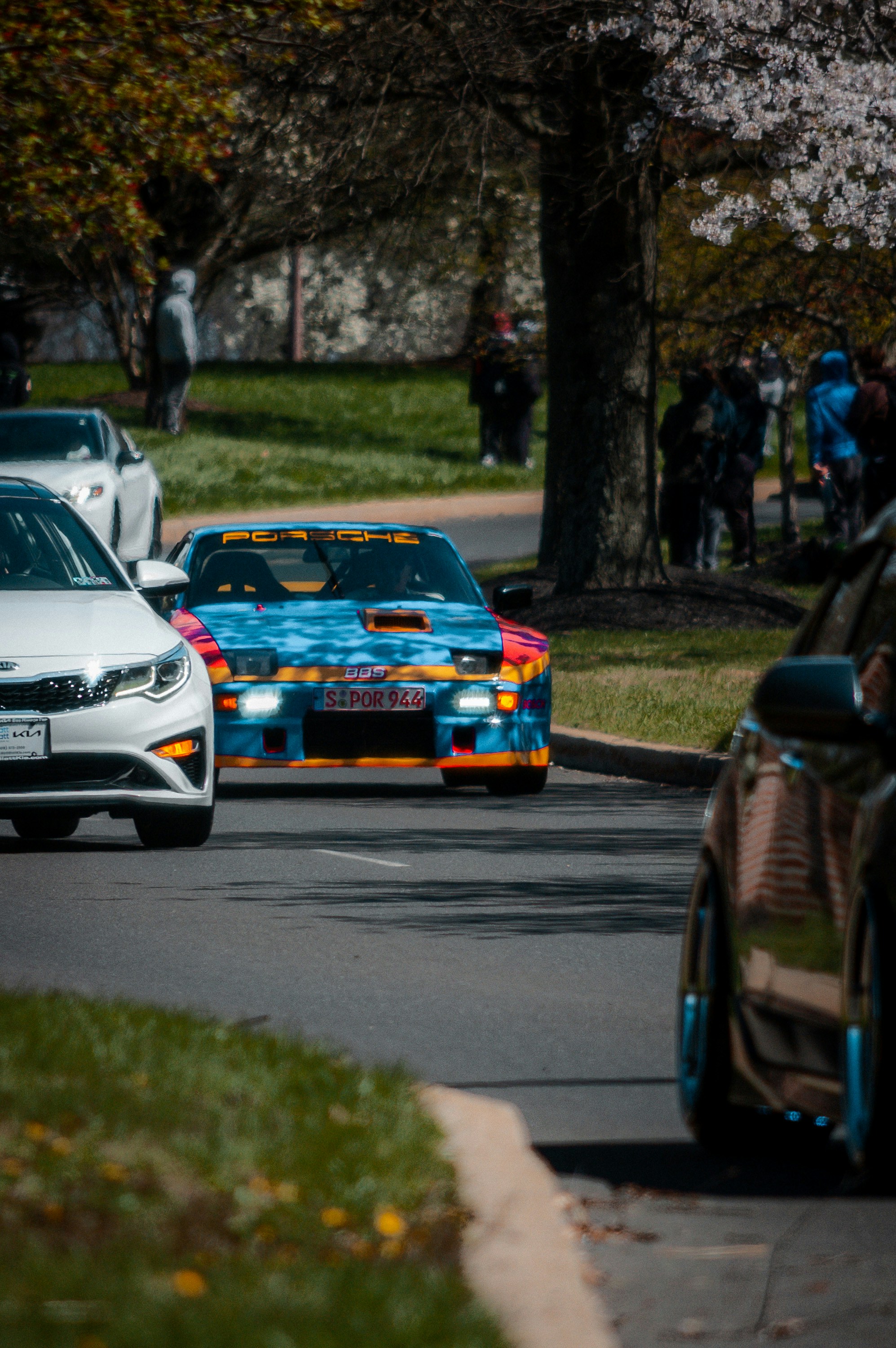 Blue Porsche Rally: Center Stage on a Park Road