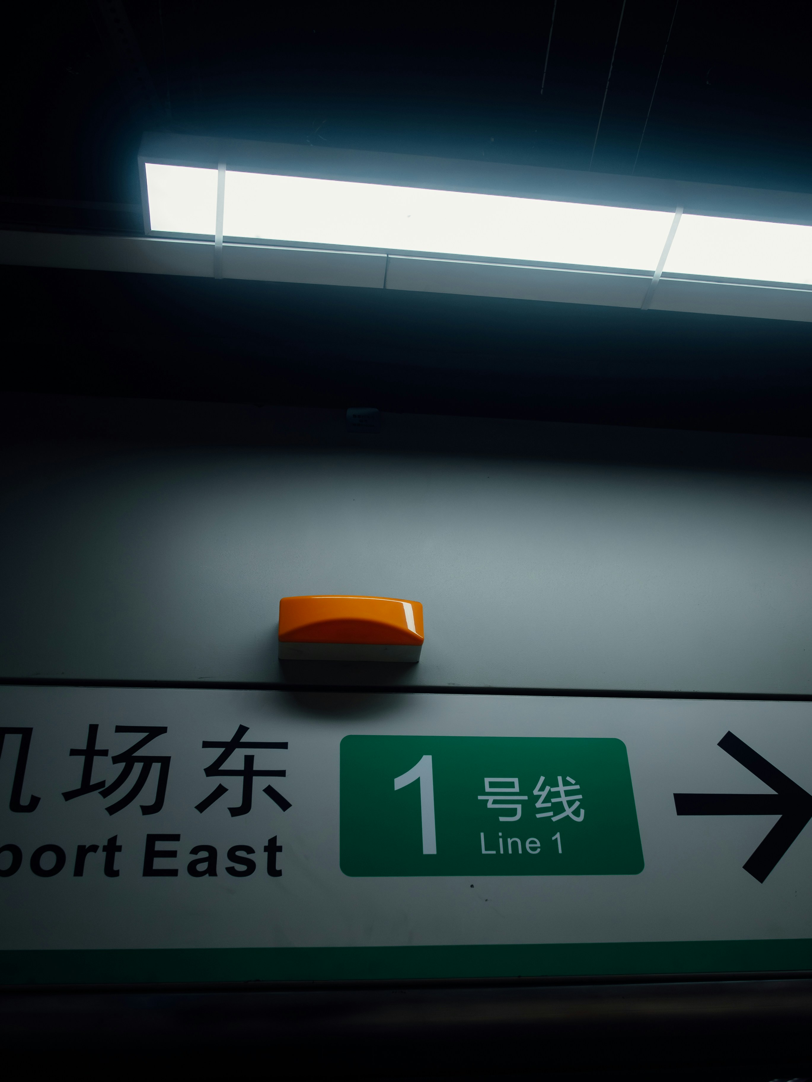 A green and white sign with a light above it photo – Free Car Image on ...