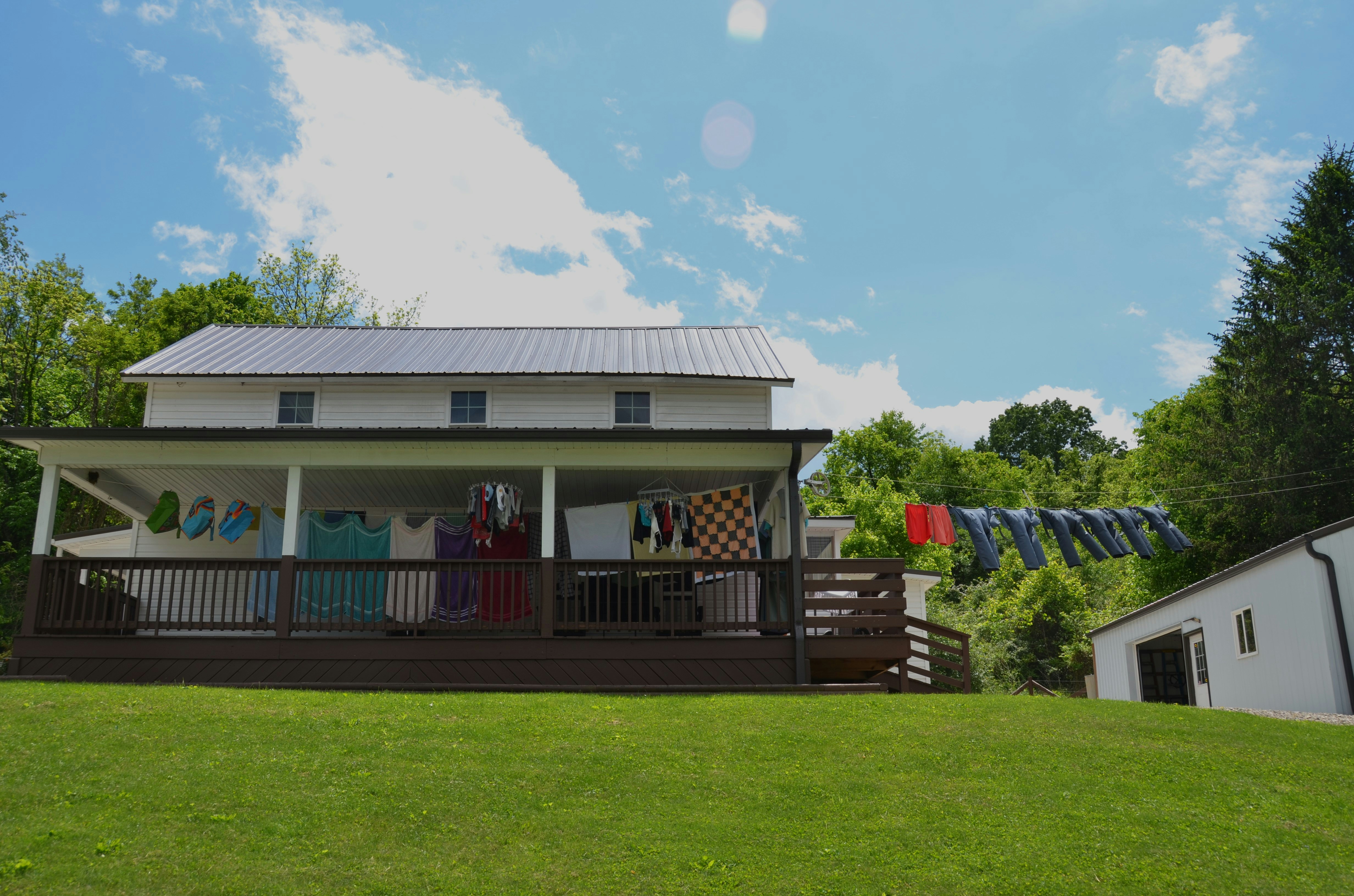 A house with clothes hanging on a clothes line photo – Free Grass Image ...