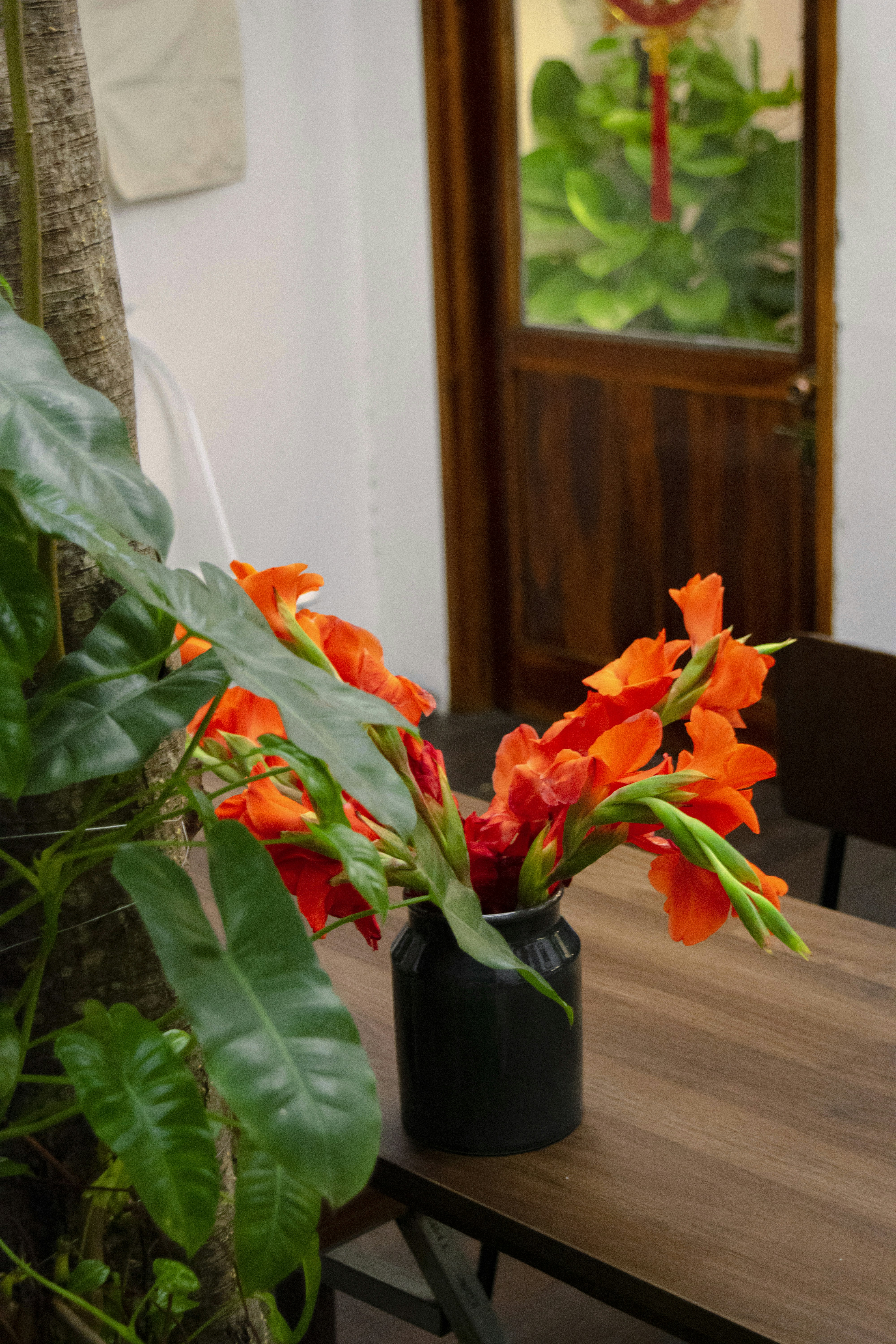 Tangerine Blooms on a Wooden Table: A Quiet Still Life