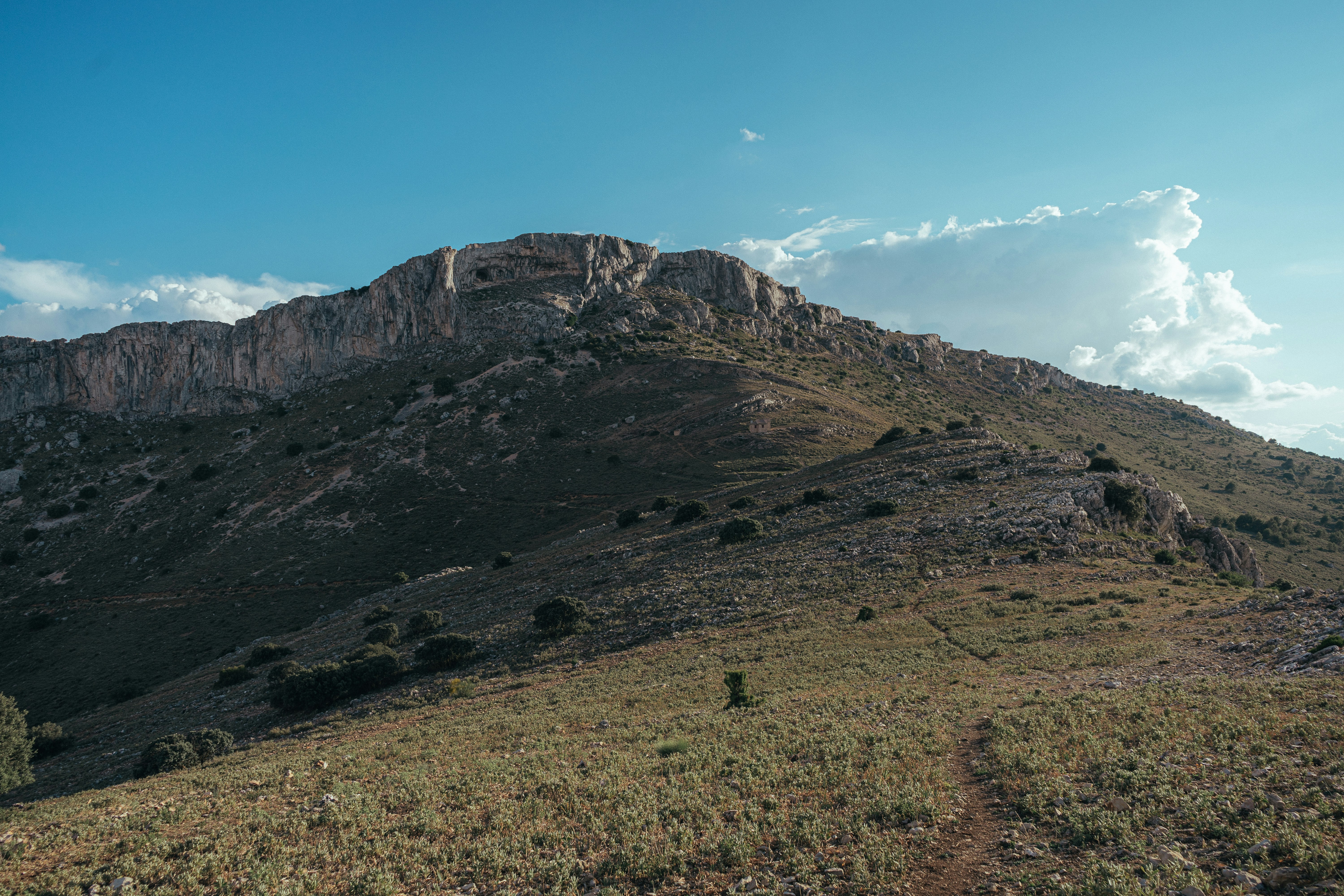 A mountain with a trail going up the side of it photo – Free Jaén Image ...