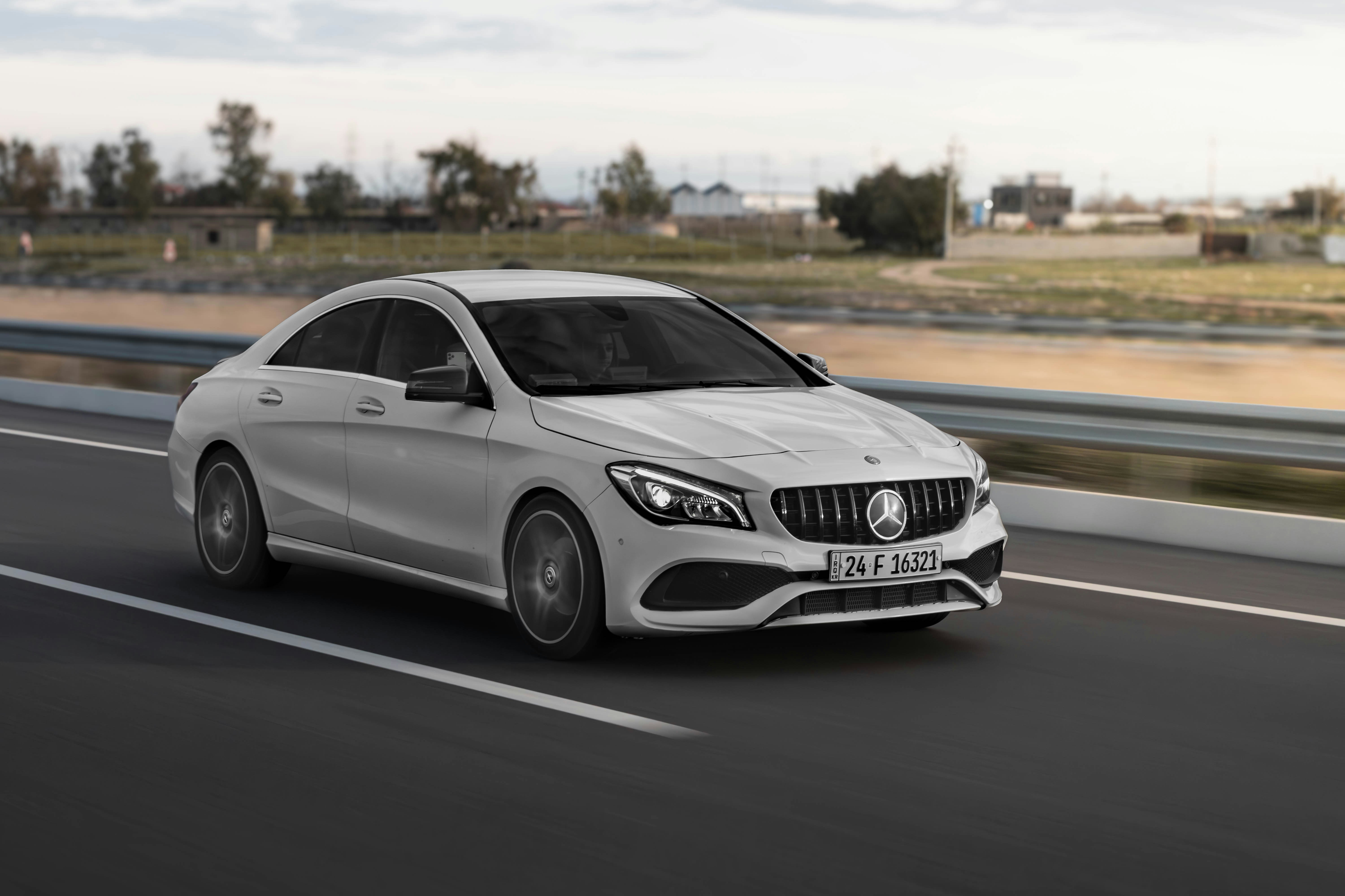 A white mercedes cla driving down a highway photo – Free Erbil Image on ...