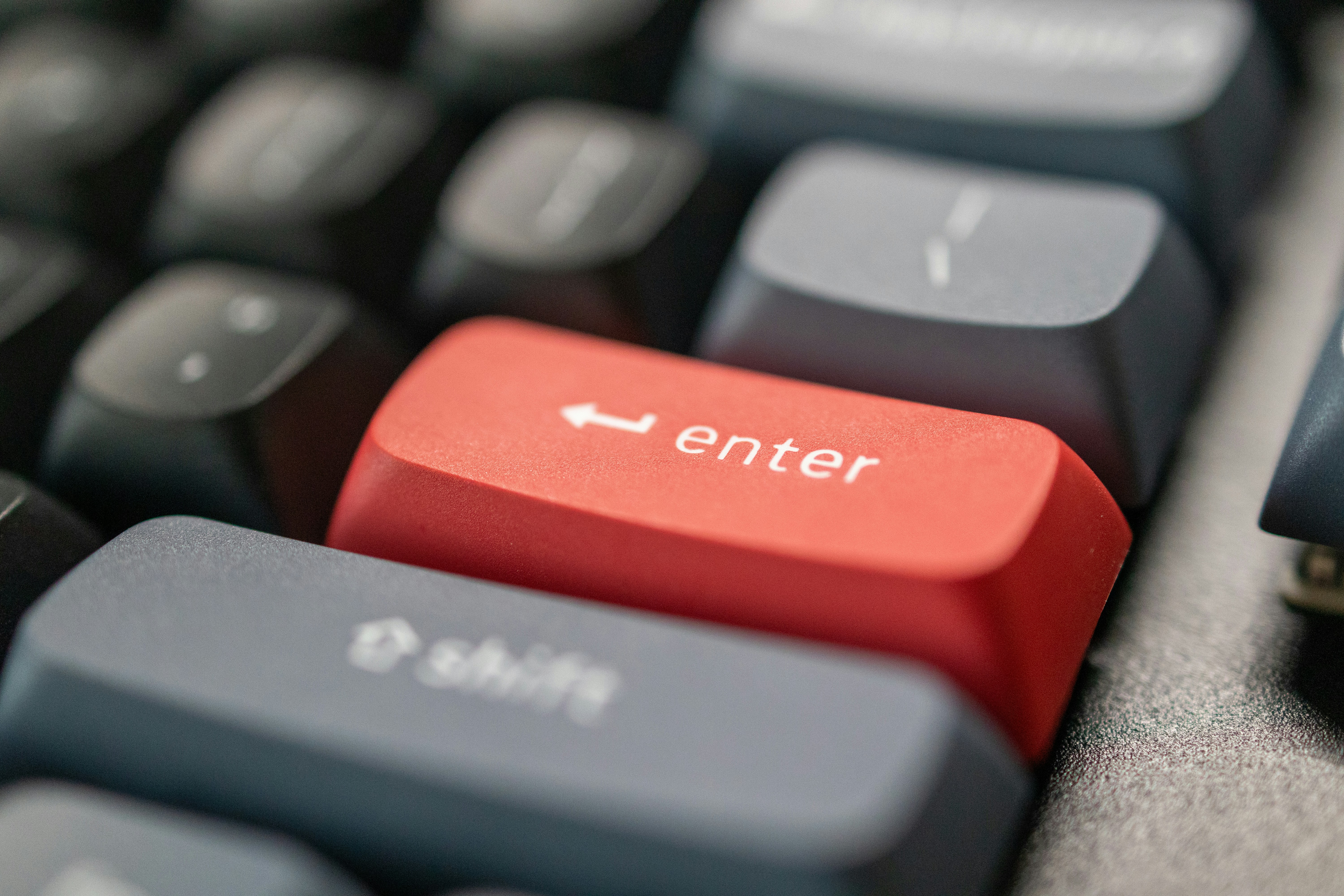 A computer keyboard with a red enter button photo – Free Enter Image on Unsplash