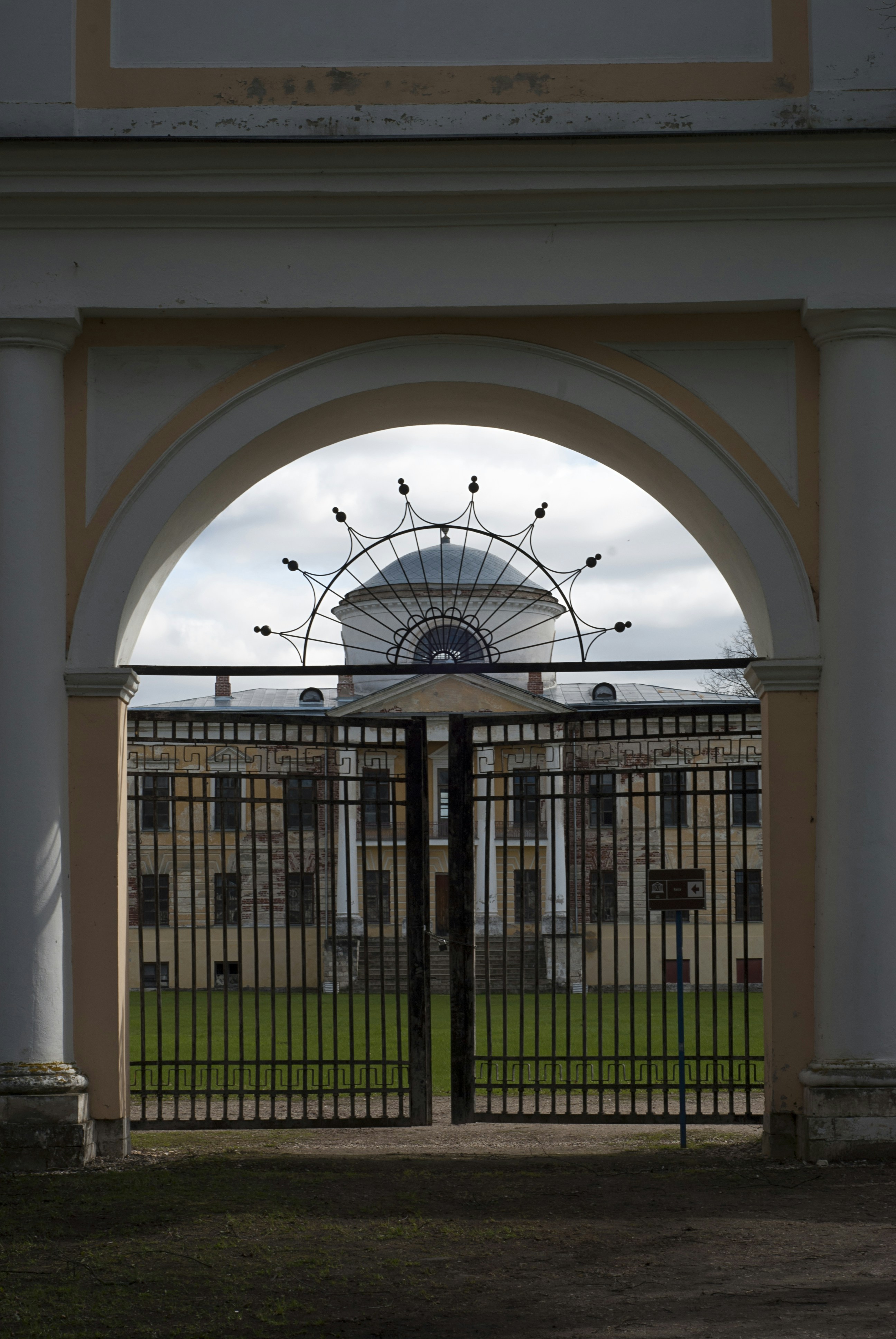 Through the Archway to the Wrought Iron Gate