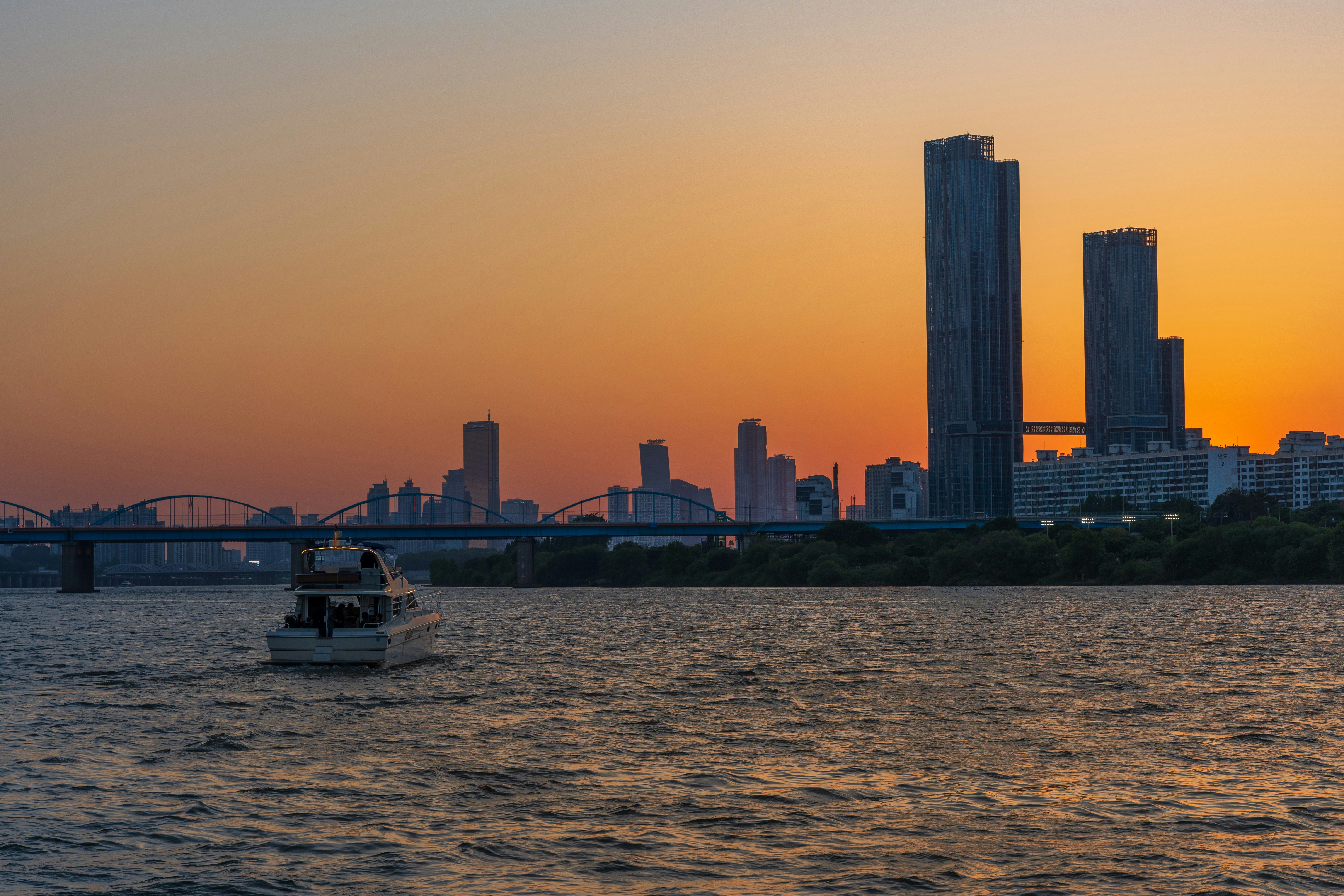 Sunset Over the River with Modern Skyline