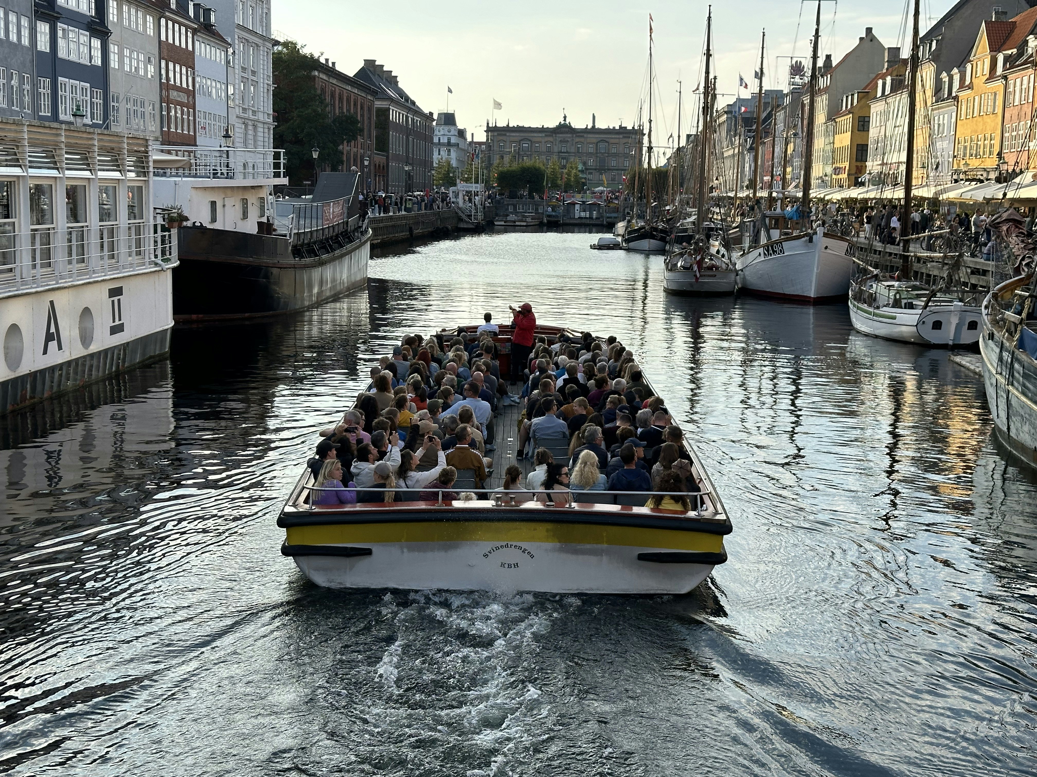 Central Nyhavn Run: A Packed Tour Boat Slices Through Copenhagen's Colorful Canal
