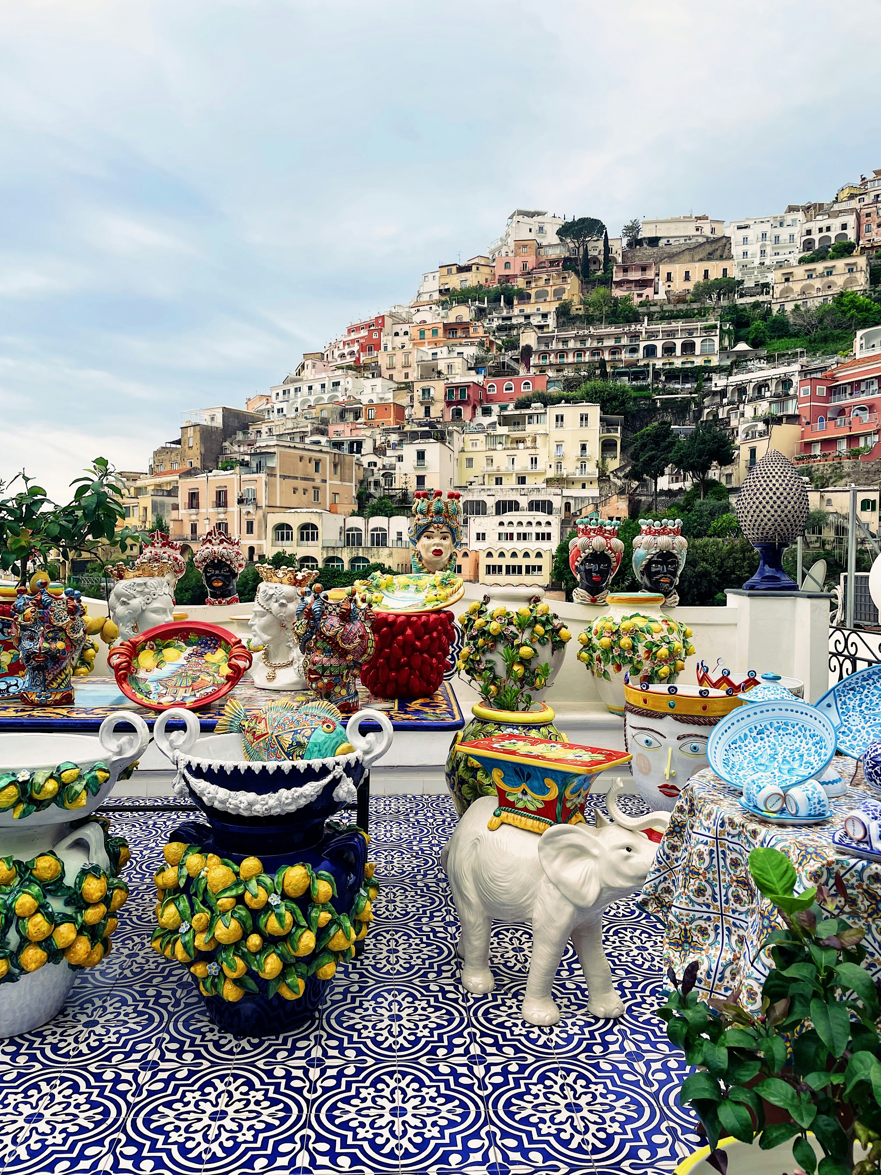 Terraced Mosaic Over Positano: Ceramics, Lamps, and Hillside Colour
