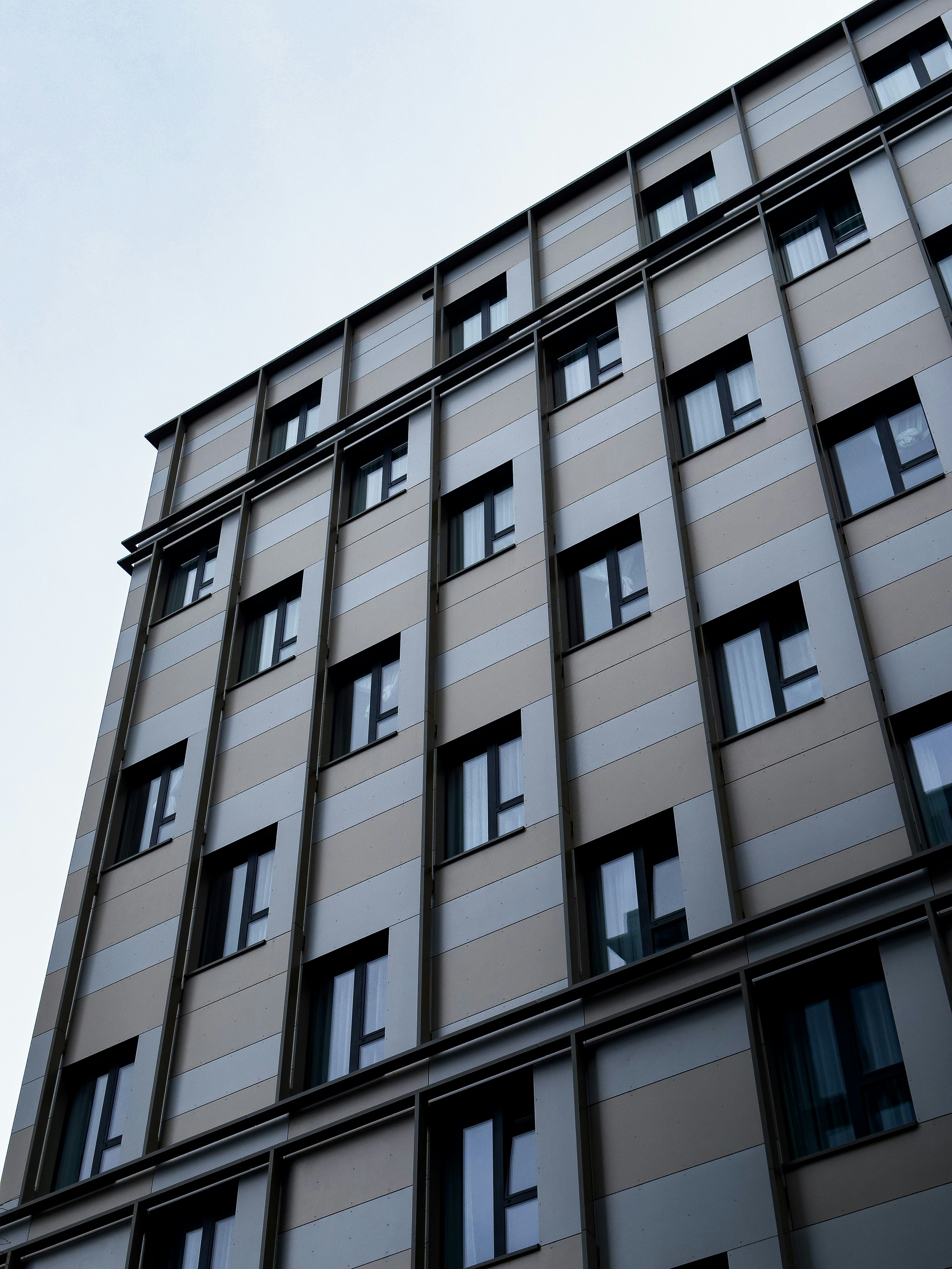 A tall building with lots of windows on top of it photo – Free Vienna ...