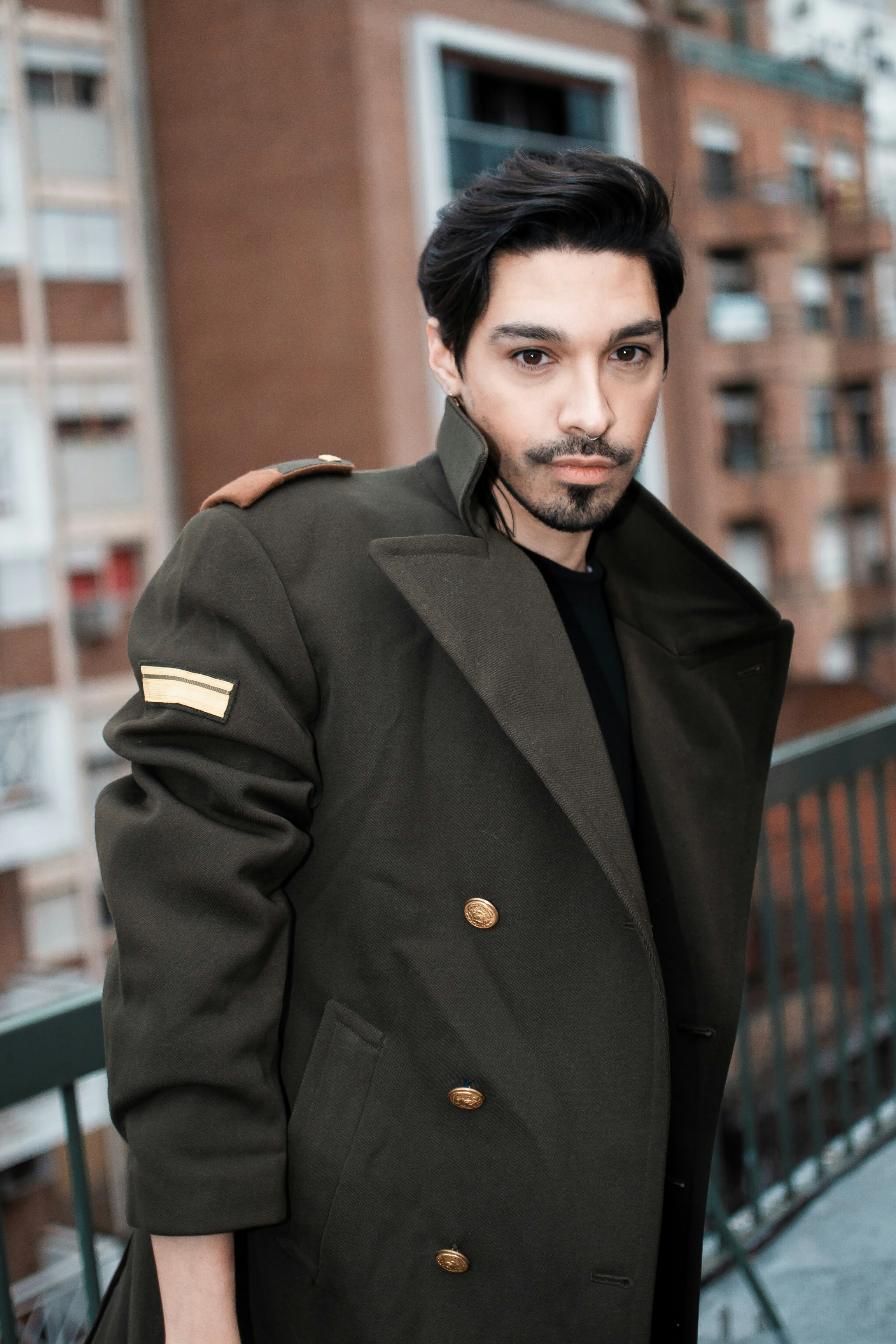 City-edge Portrait in an Olive Overcoat