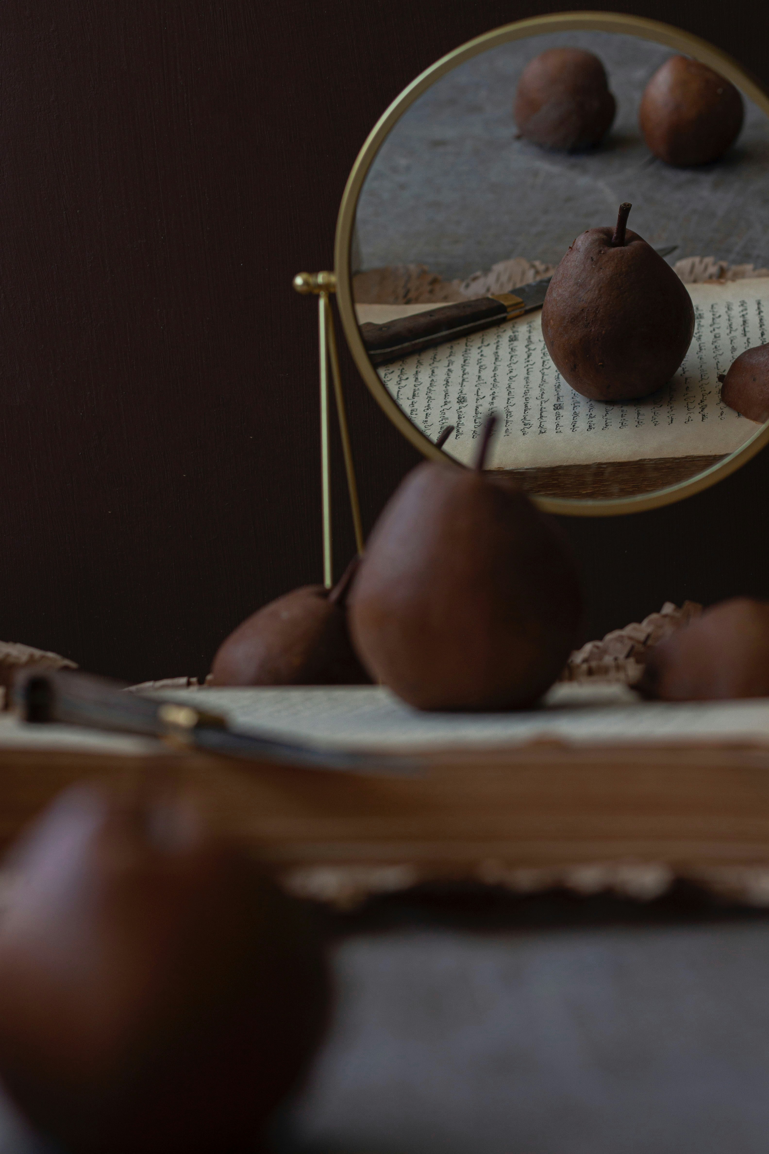 Reflections on a Page: Pears, a Gilded Mirror, and Quiet Light
