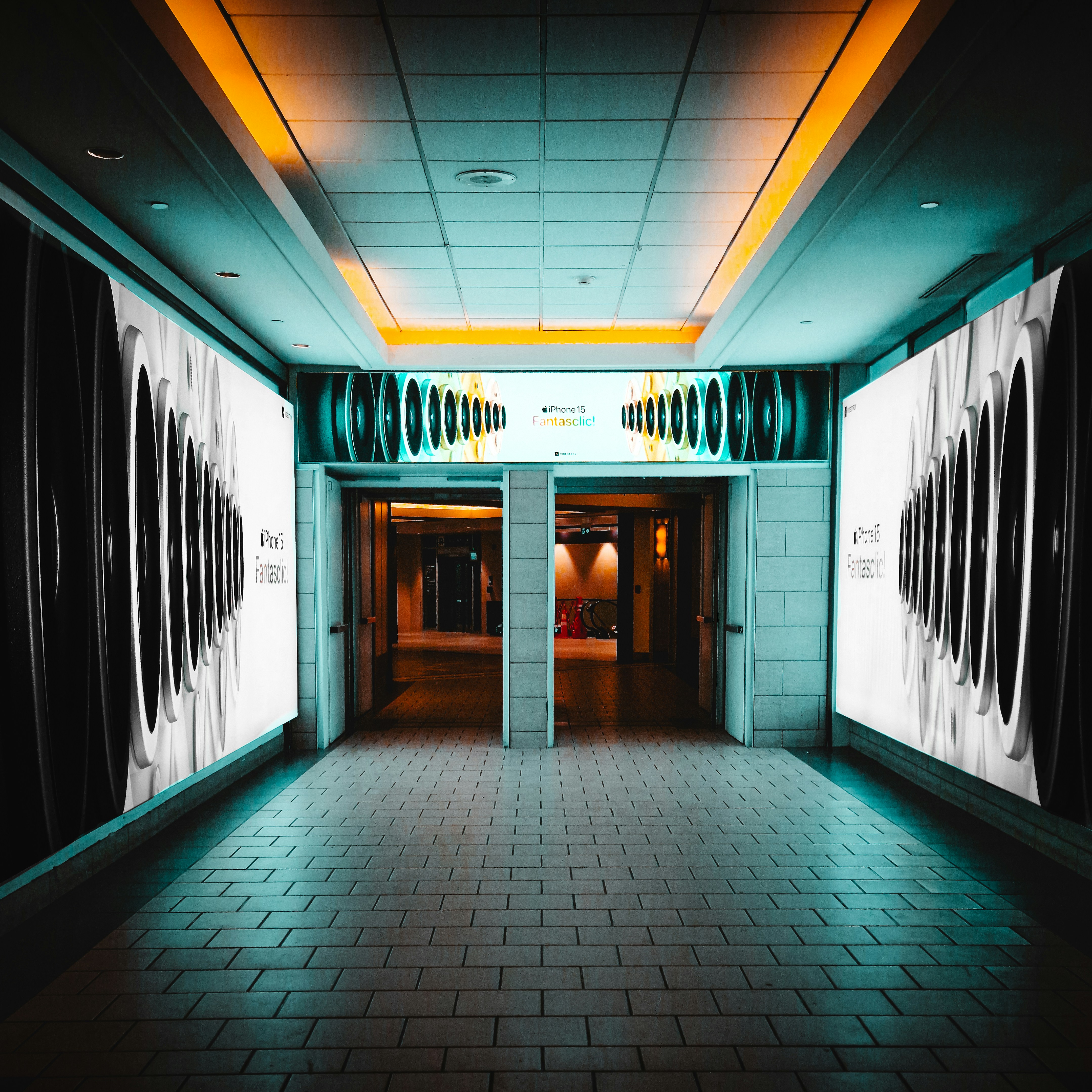 Teal Neon Corridor: Circular Wall Motifs Converging on a Quiet Portal