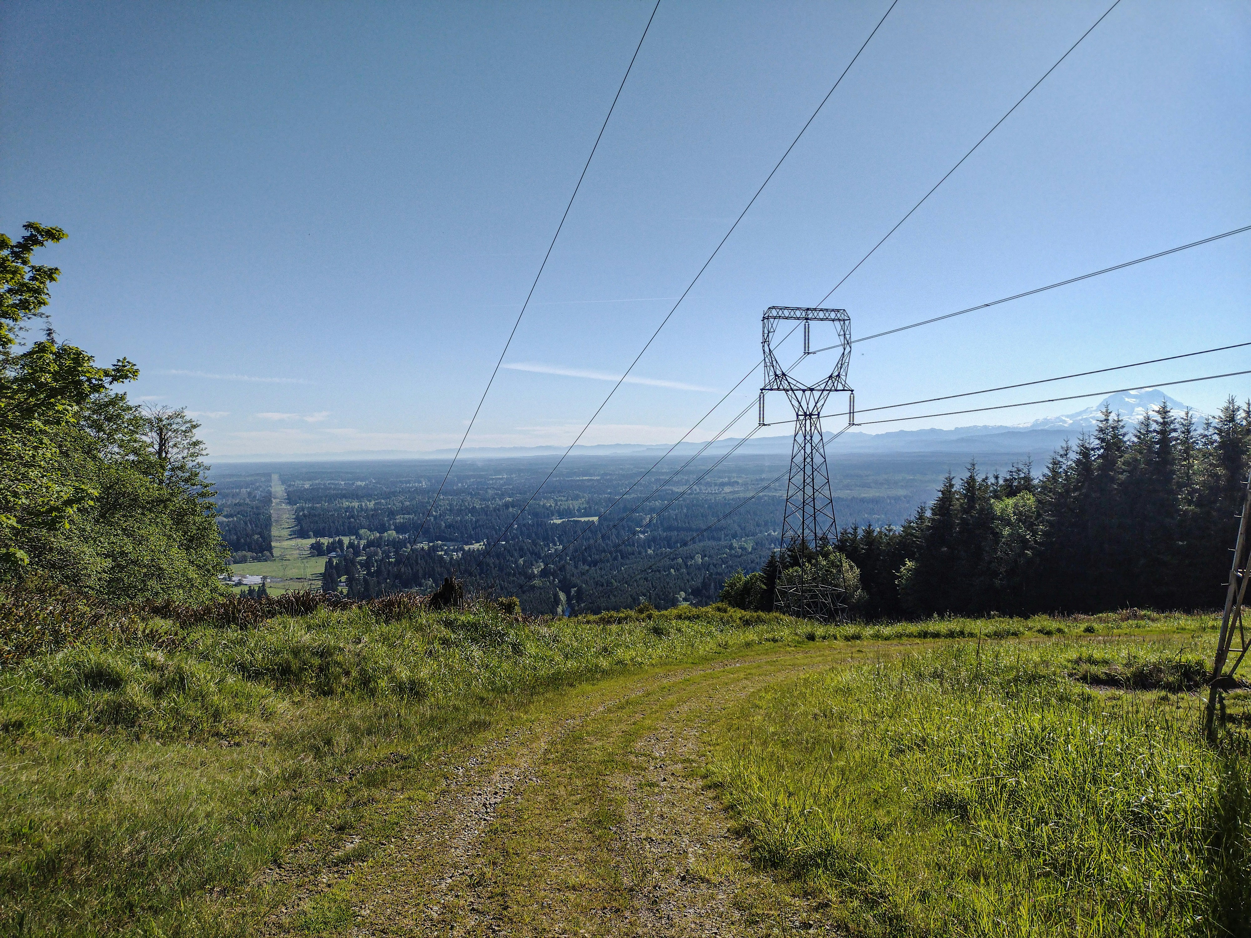 Ridgeview Overlook: Valley, Trail, and a Looming Lattice